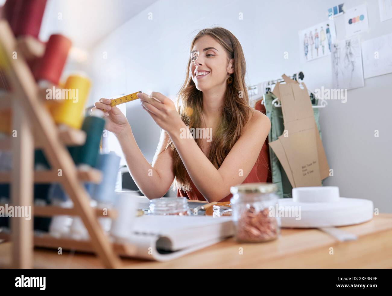 Designer woman, measure and tape in workshop, small business or factory ...