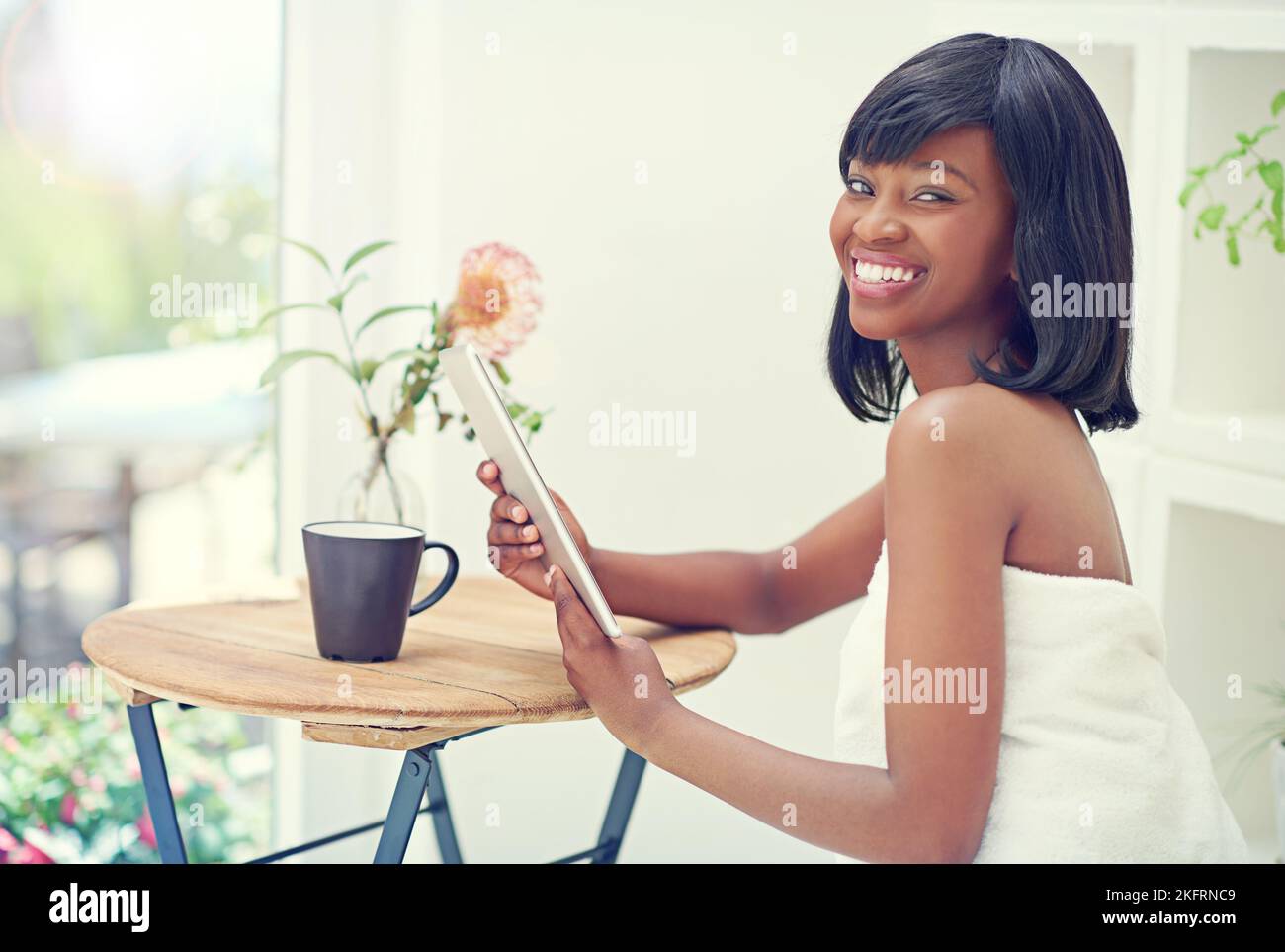 This tablet is a must have. an attractive young woman enjoying her ...