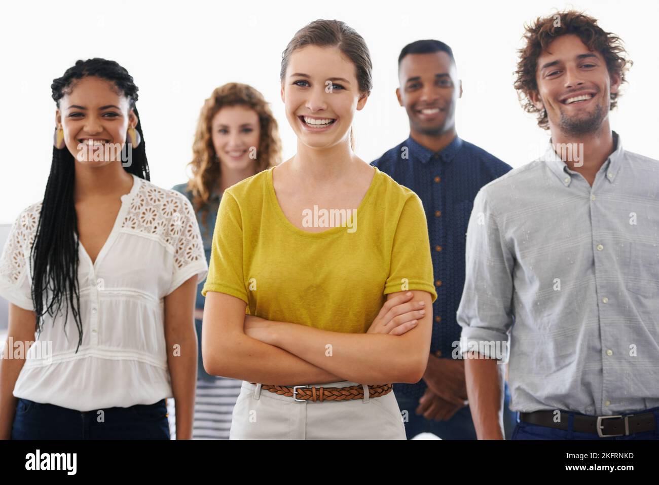 This team is prepared. a group of work colleagues against a white ...