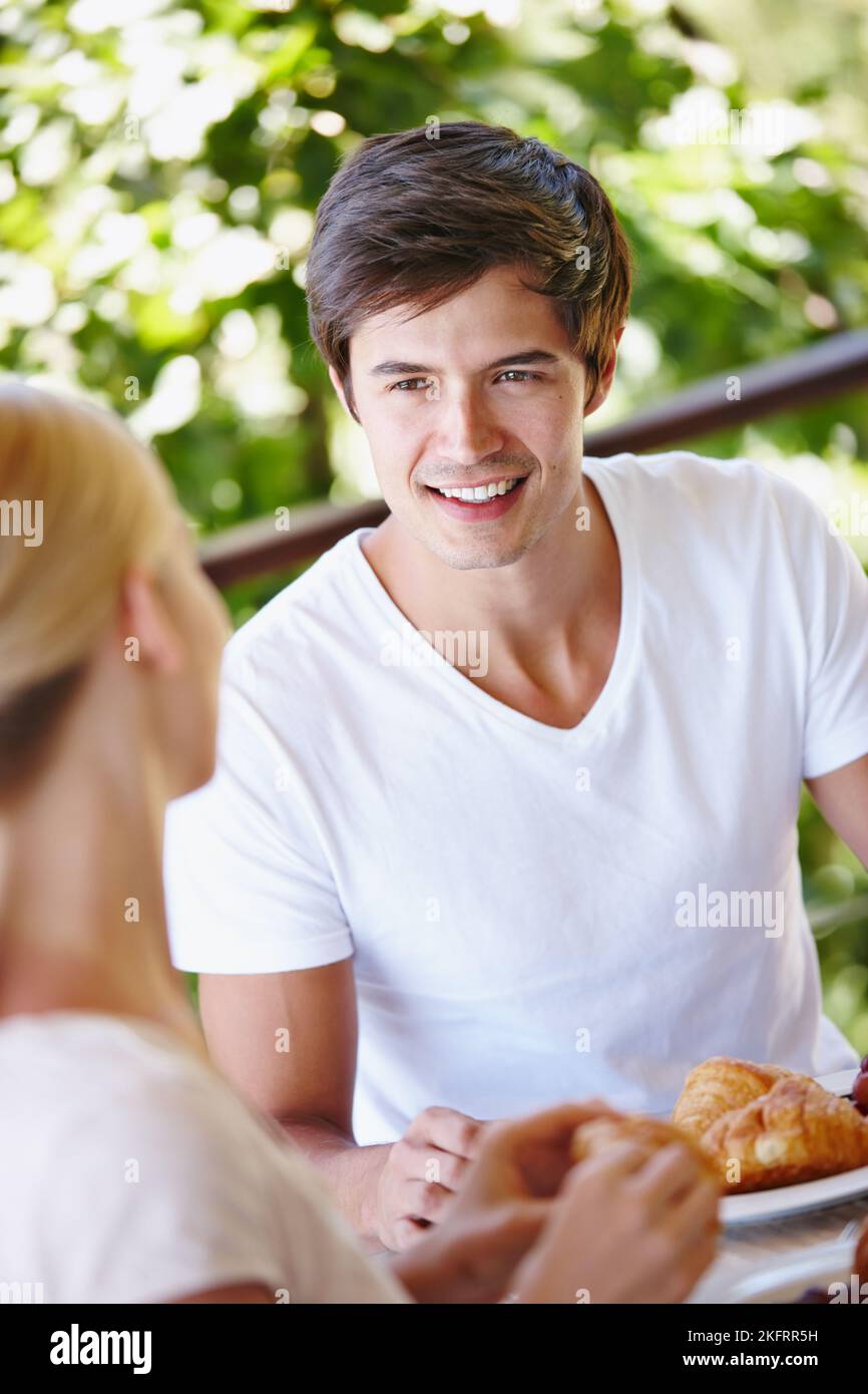 Its just better and brighter at breakfast. a happy young couple eating ...