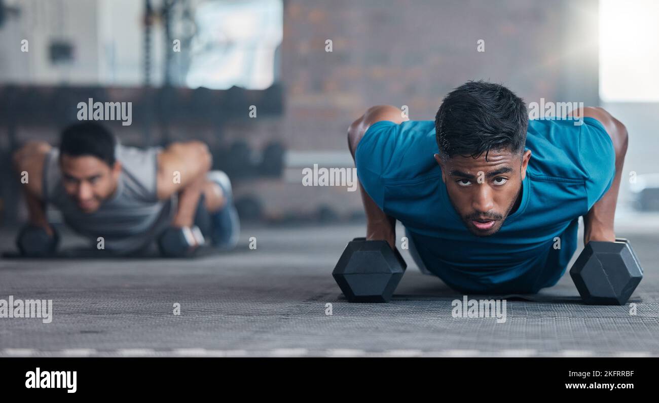 Fitness, dumbbell weights and men doing a push up exercise for strength ...