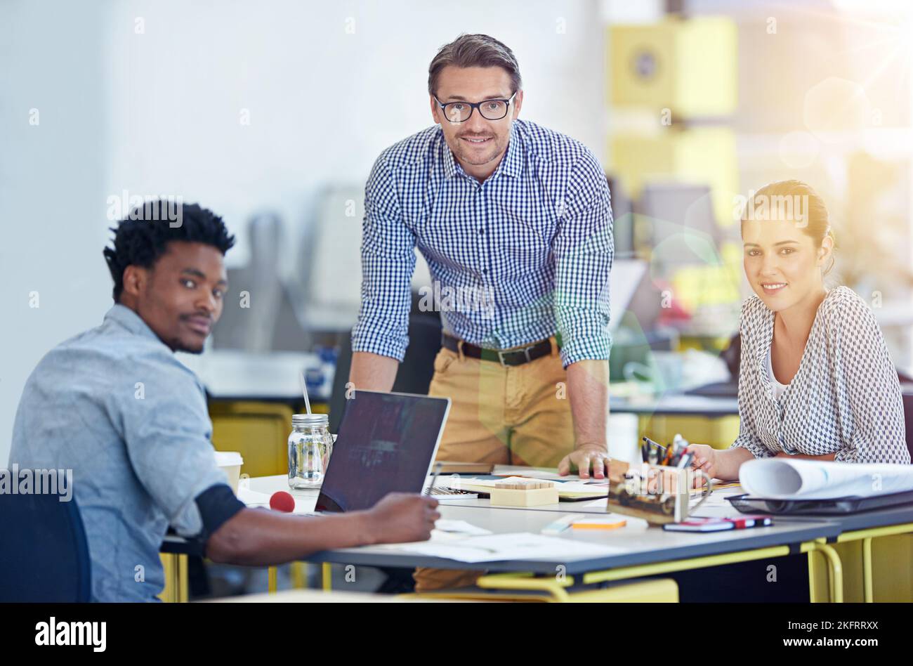 We make success our business. Portrait of a group of people working at ...