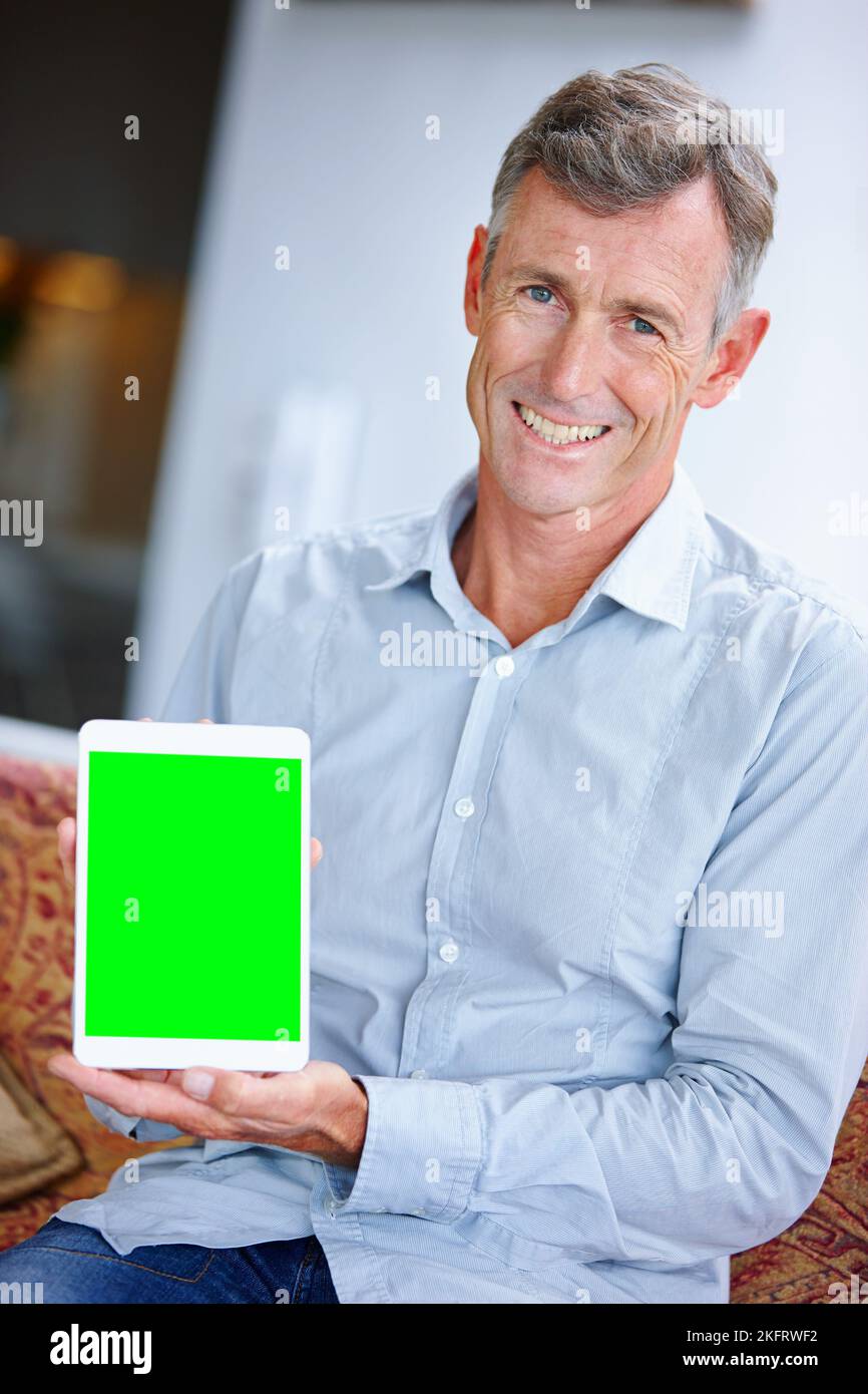 Staying connected is easier than ever. Portrait of a mature man holding ...