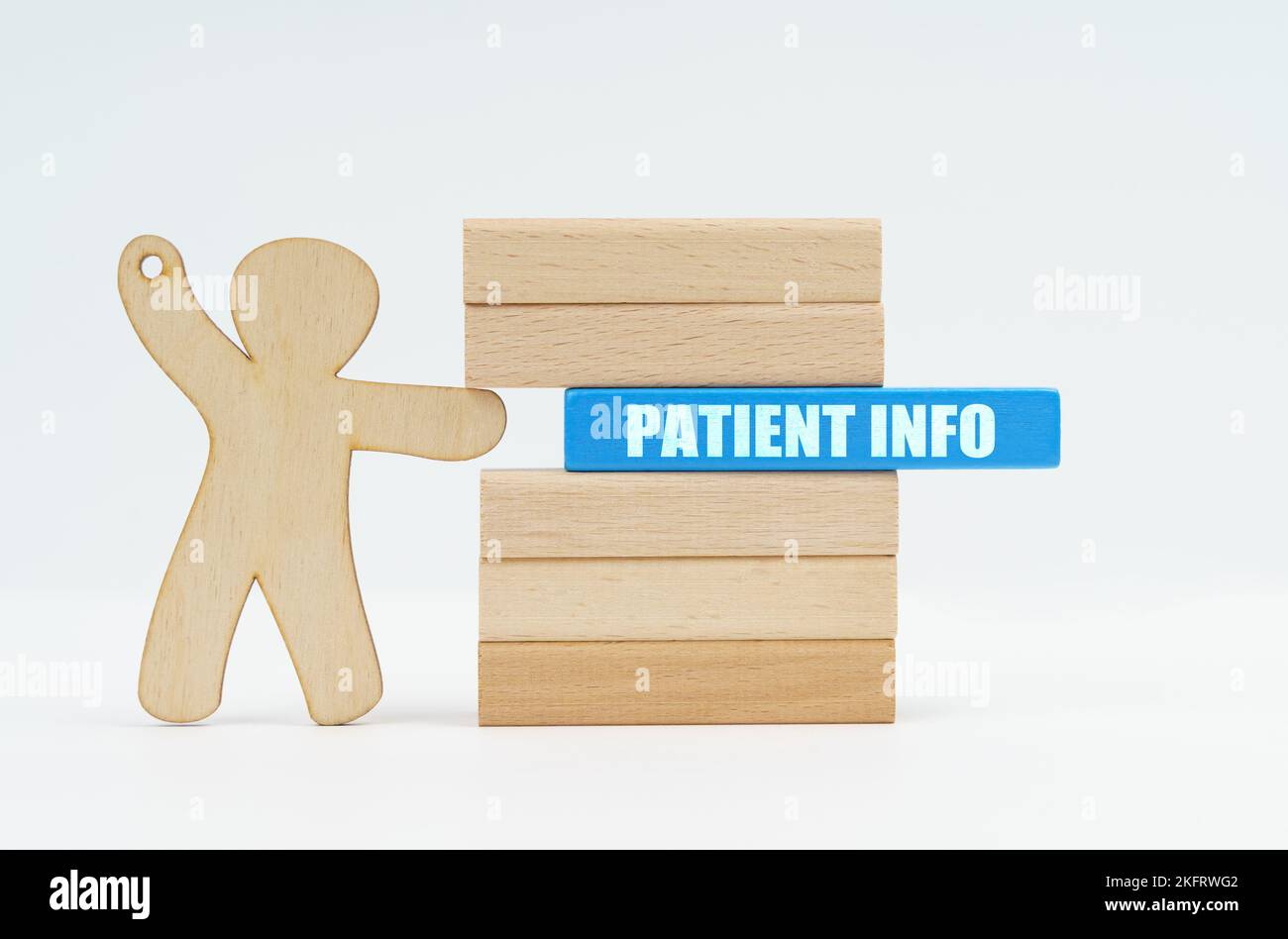 Medicine and healthcare concept. A human figurine pushes a blue wooden ...