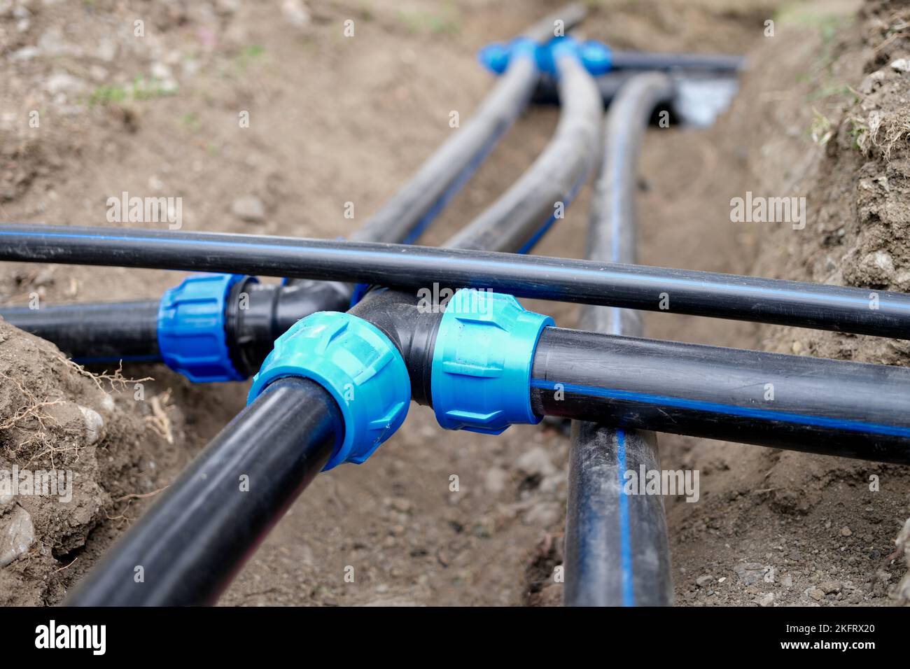 Polyethylene water pipes at construction site Stock Photo - Alamy