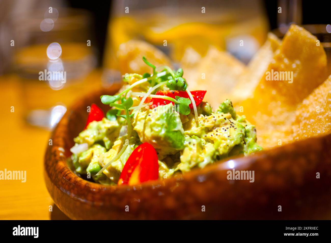 Fresh avocado and shrimps salad with nachos on side Stock Photo - Alamy
