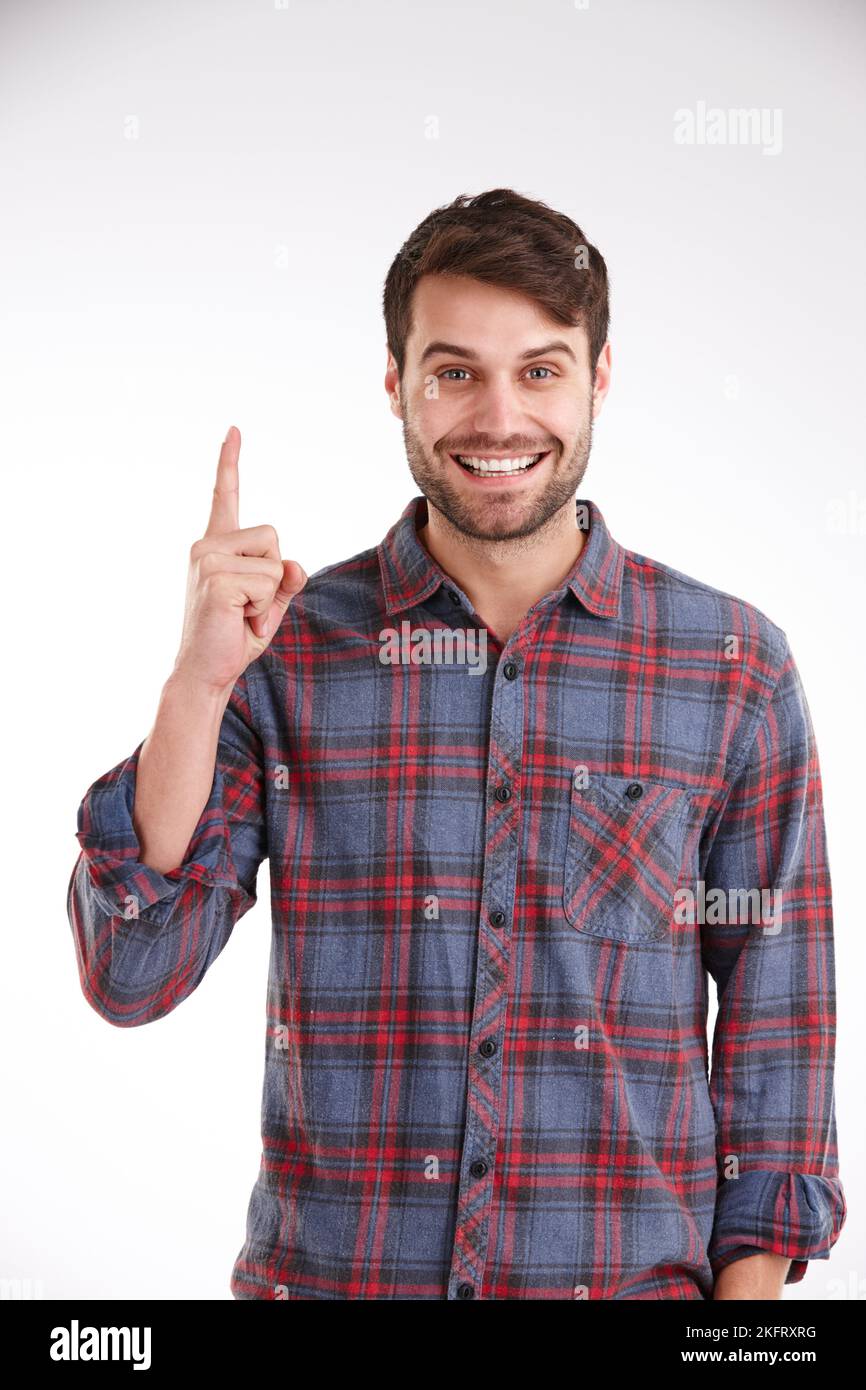 Have you seen this. Studio shot of a smiling young man pointing ...