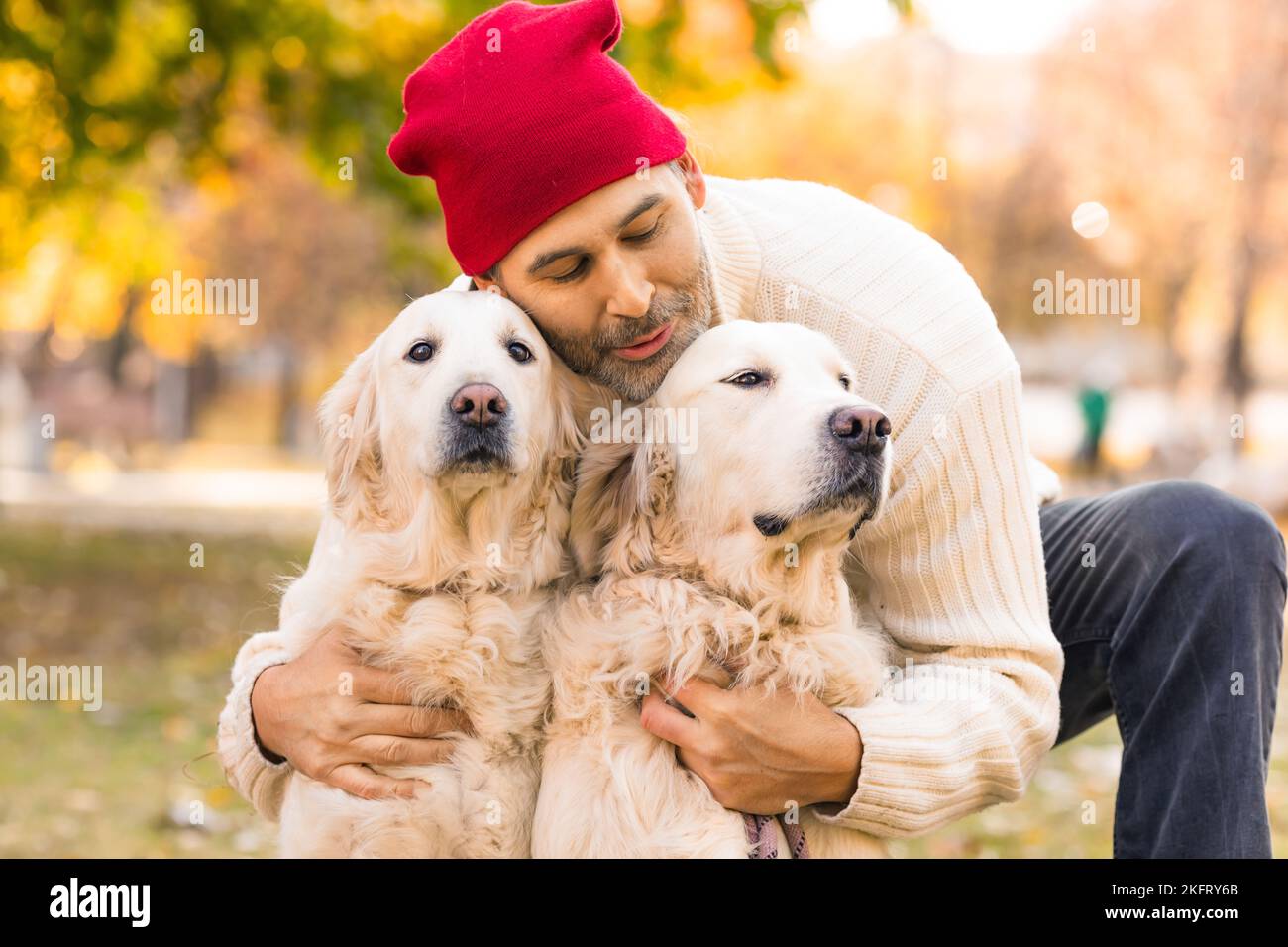 Two dogs kissing man hi-res stock photography and images - Alamy