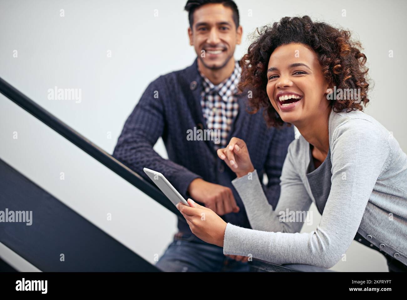 Another great meme. Portrait of two colleagues using a digital tablet ...