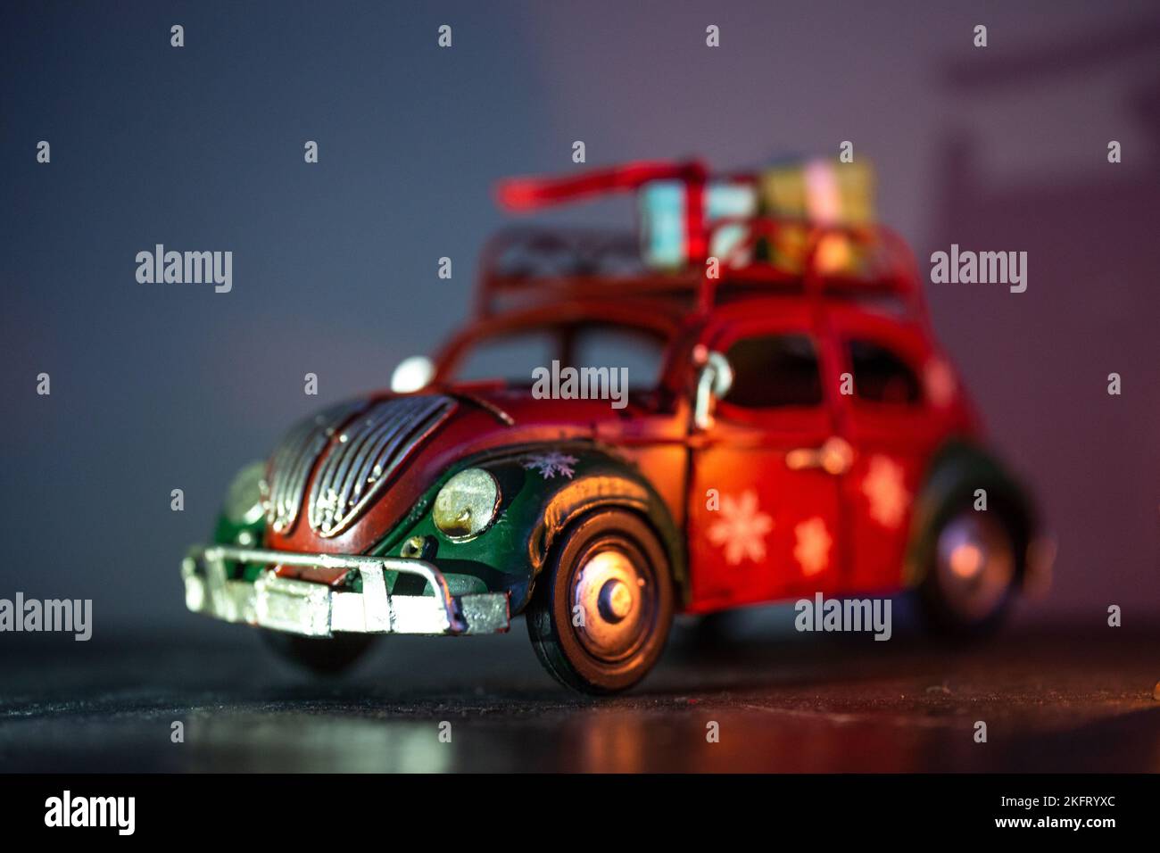 A small metal retro Christmas car with a gift box. Gift delivery ...