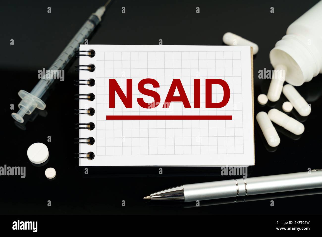 Medicine and healthcare concept. On the black surface are pills, a ...