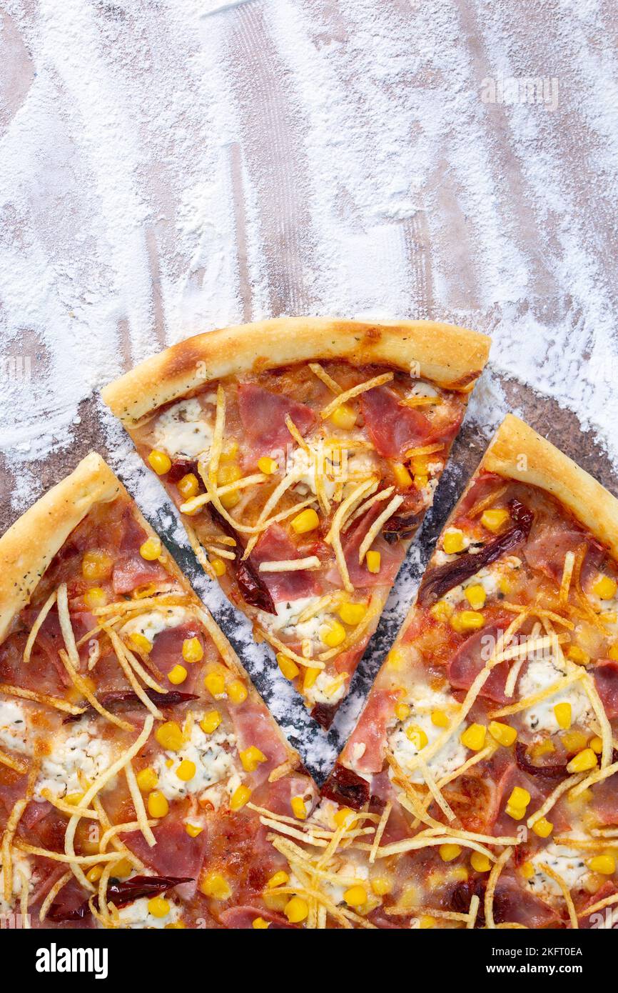 a slice is cut off from the pizza top view. photo for pizza advertising ...