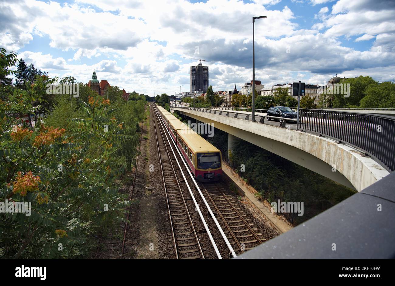 A train of the S-Bahn line S1 to Wannsee and the motorway A103, driving ...