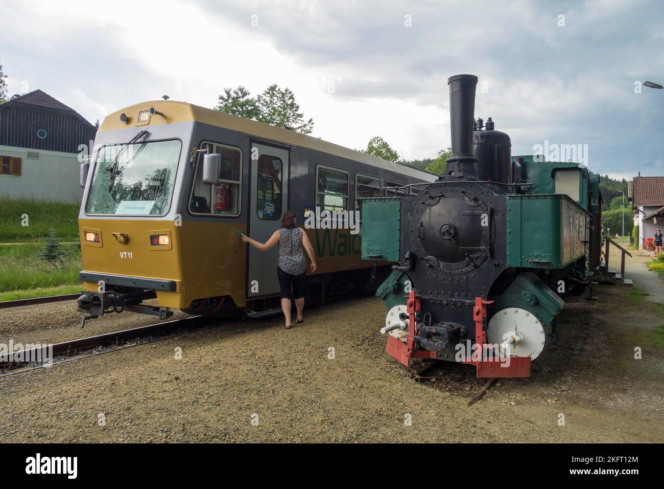Modern set of the Waldviertelbahn and steam locomotive at the station ...