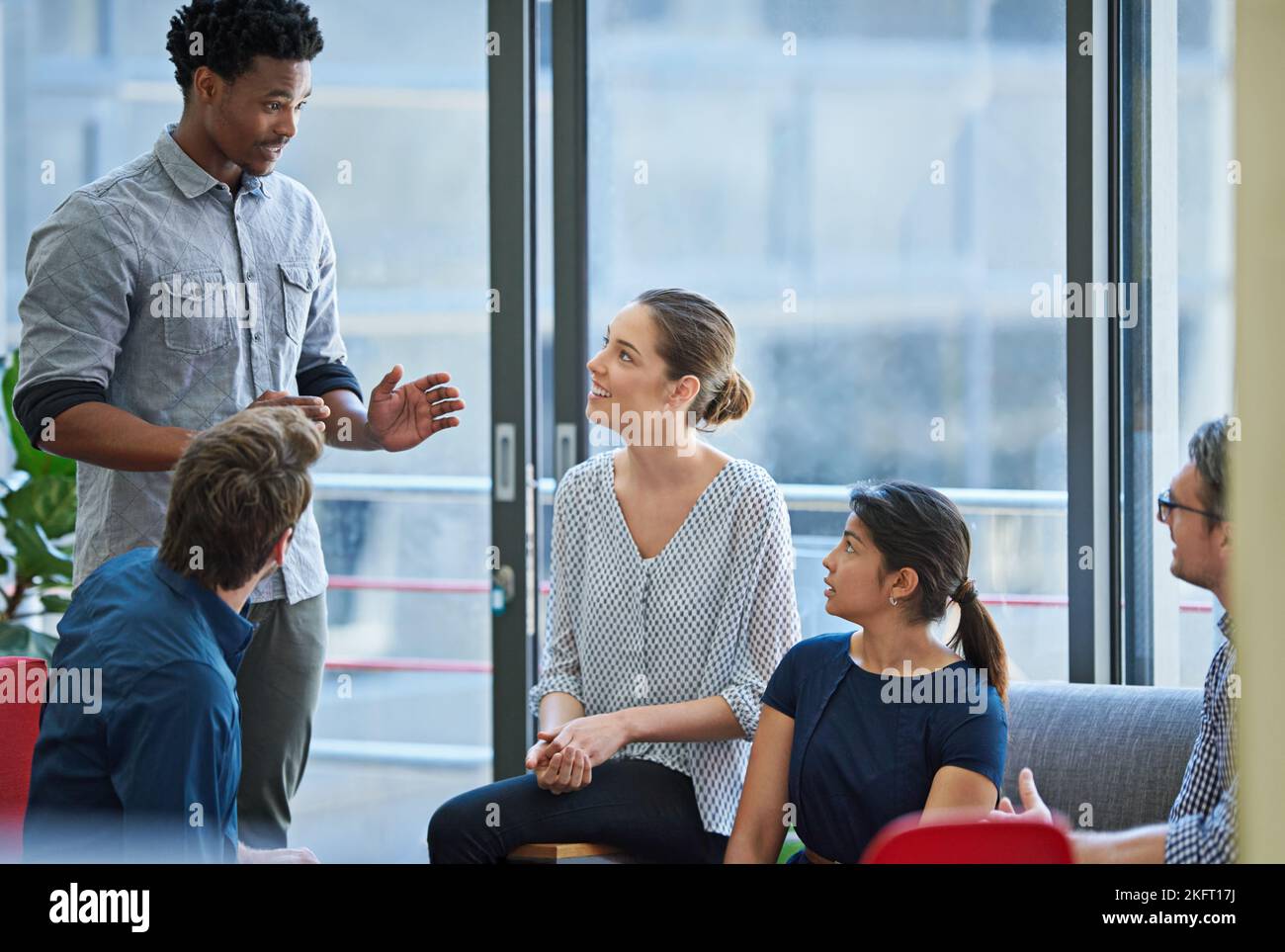 This is my plan...a group of office workers talking together in a ...