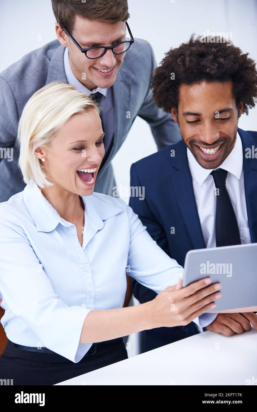 Start the day with some light-hearted fun. three smiling colleagues ...