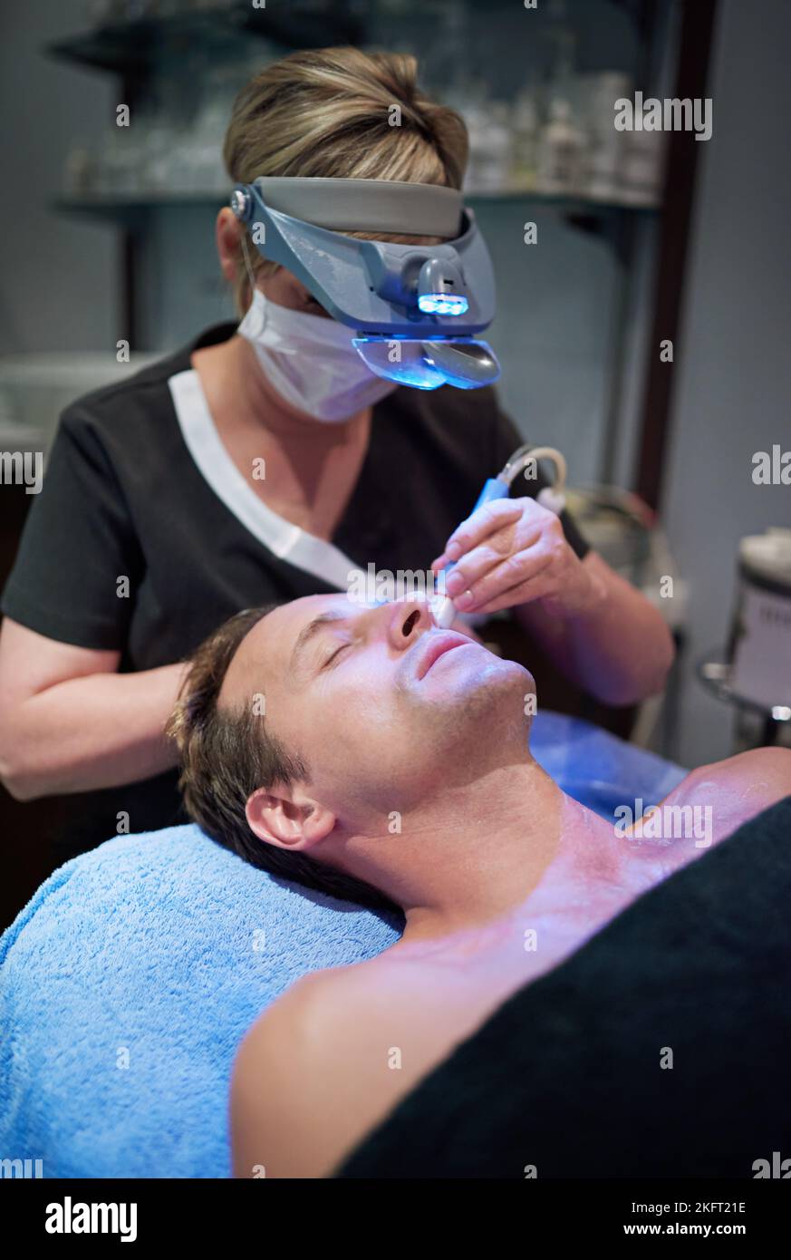 Making a younger you. a man getting a non-invasive face lift at a ...