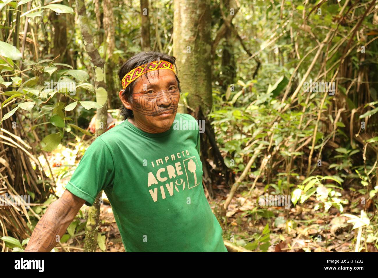 Indigenous people, man of the indigenous people Huni Kuin standing in ...