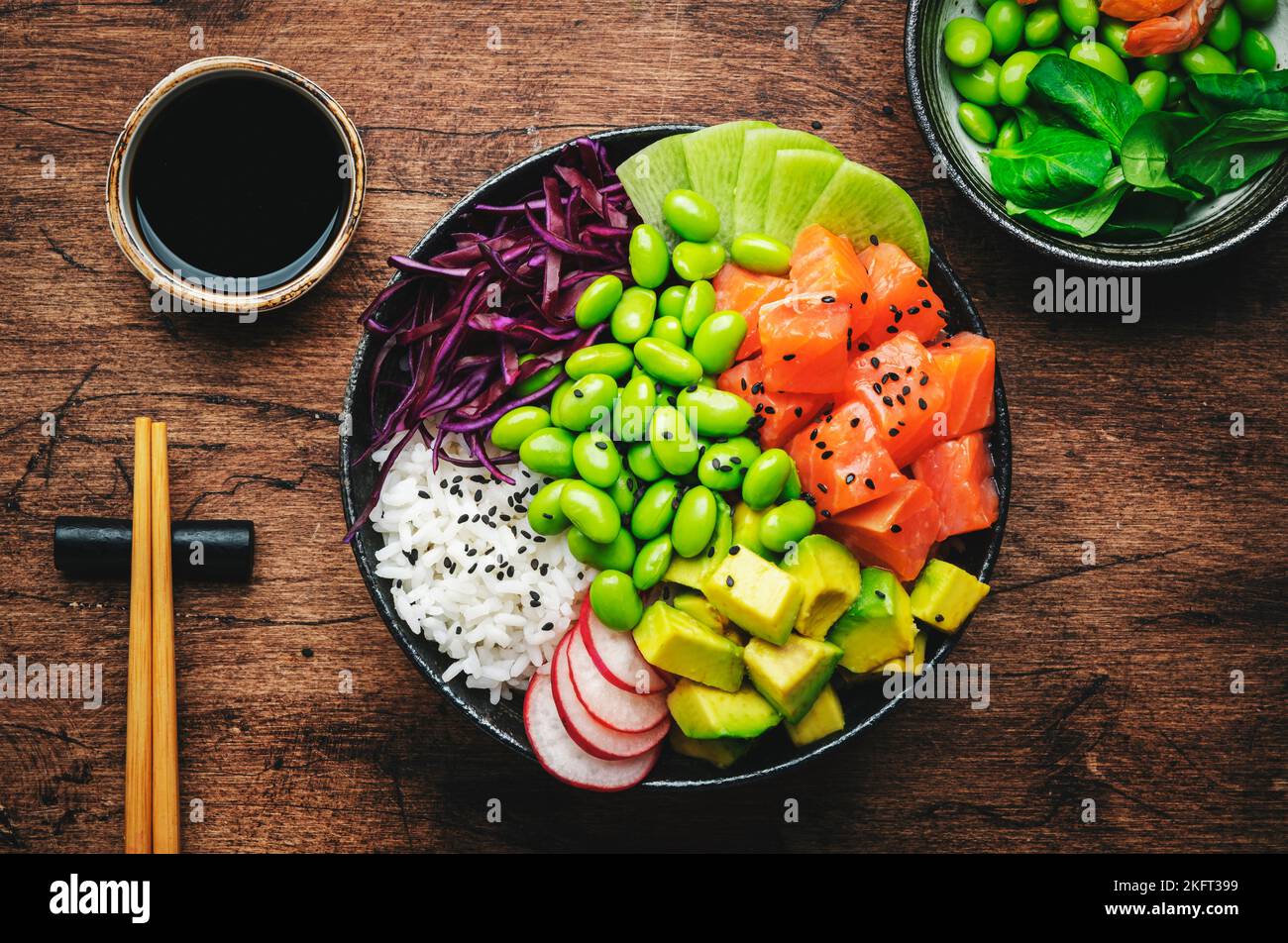 Hawaiian poke bowl with salmon, avocado, radish, edamame beans, red ...