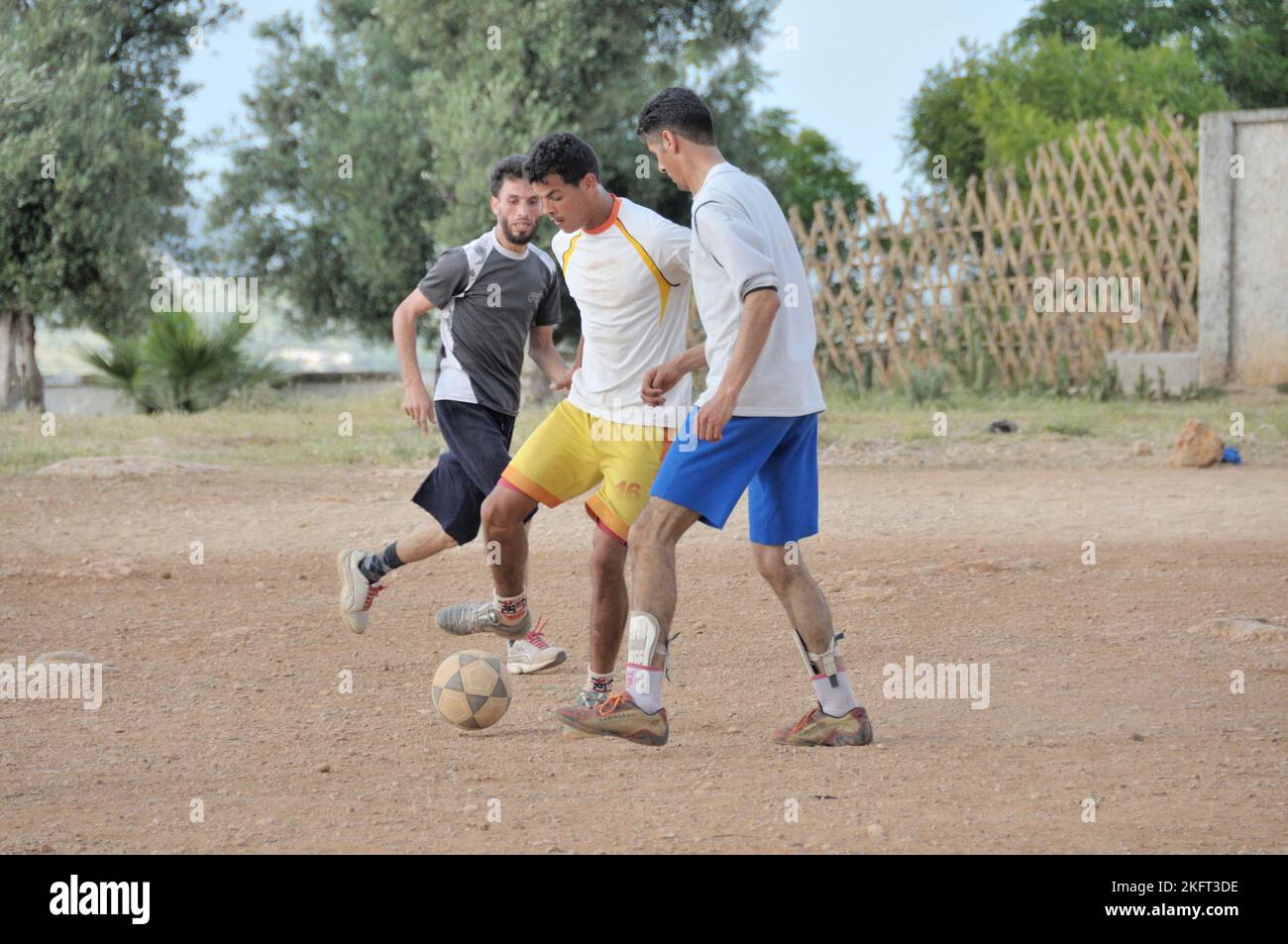 Men playing football, settlement of the poorer population outside Fes ...