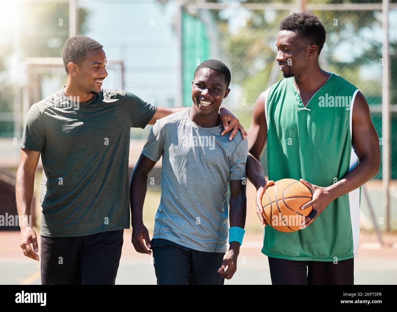 Basketball player, happy friends and walking together in conversation ...