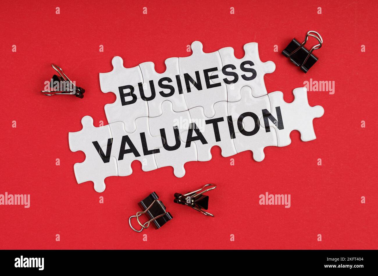 Business and Economics. On a red background, there are puzzles with the ...