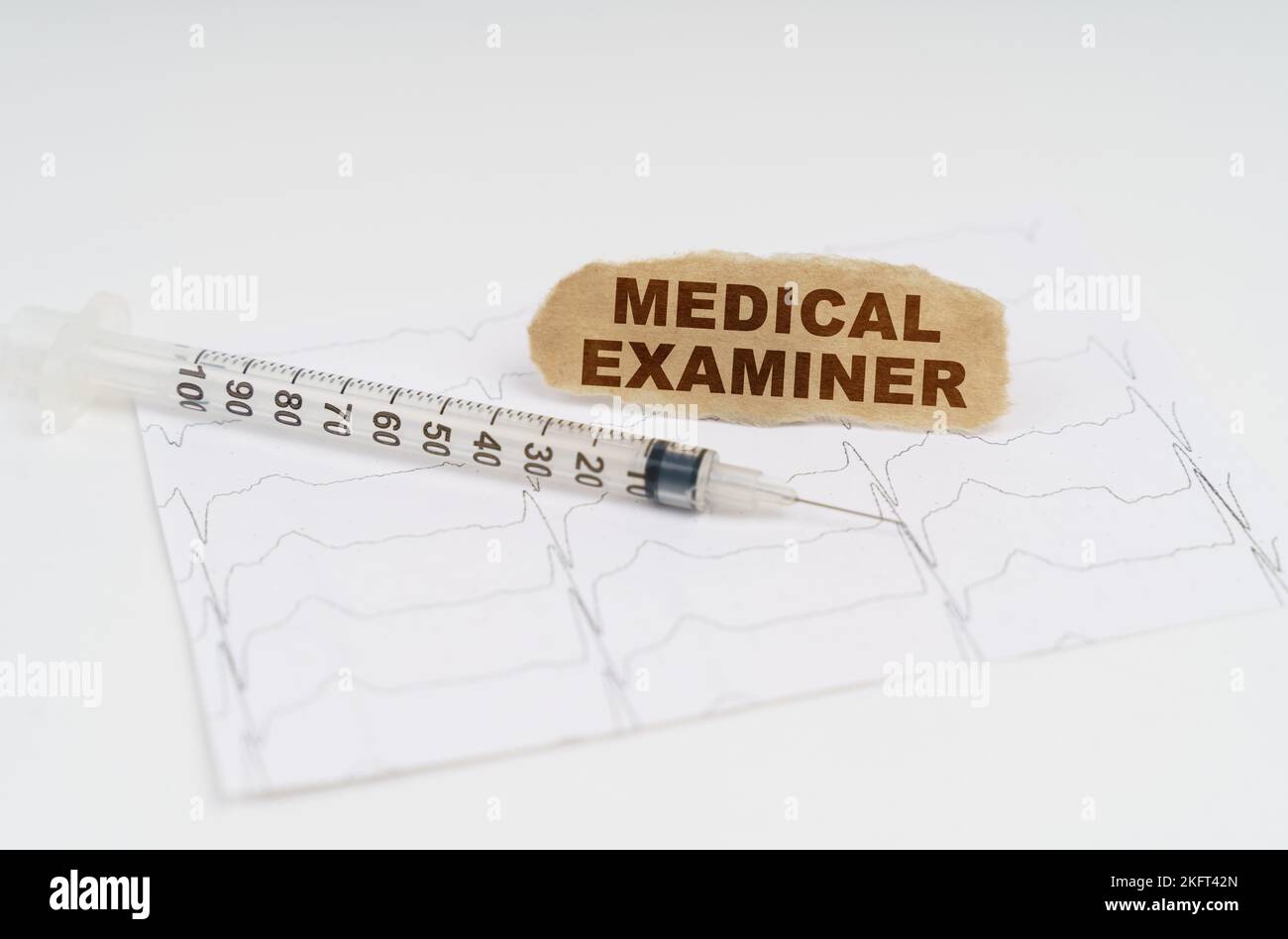 Medicine and health concept. On the table is a cardiogram, a syringe ...
