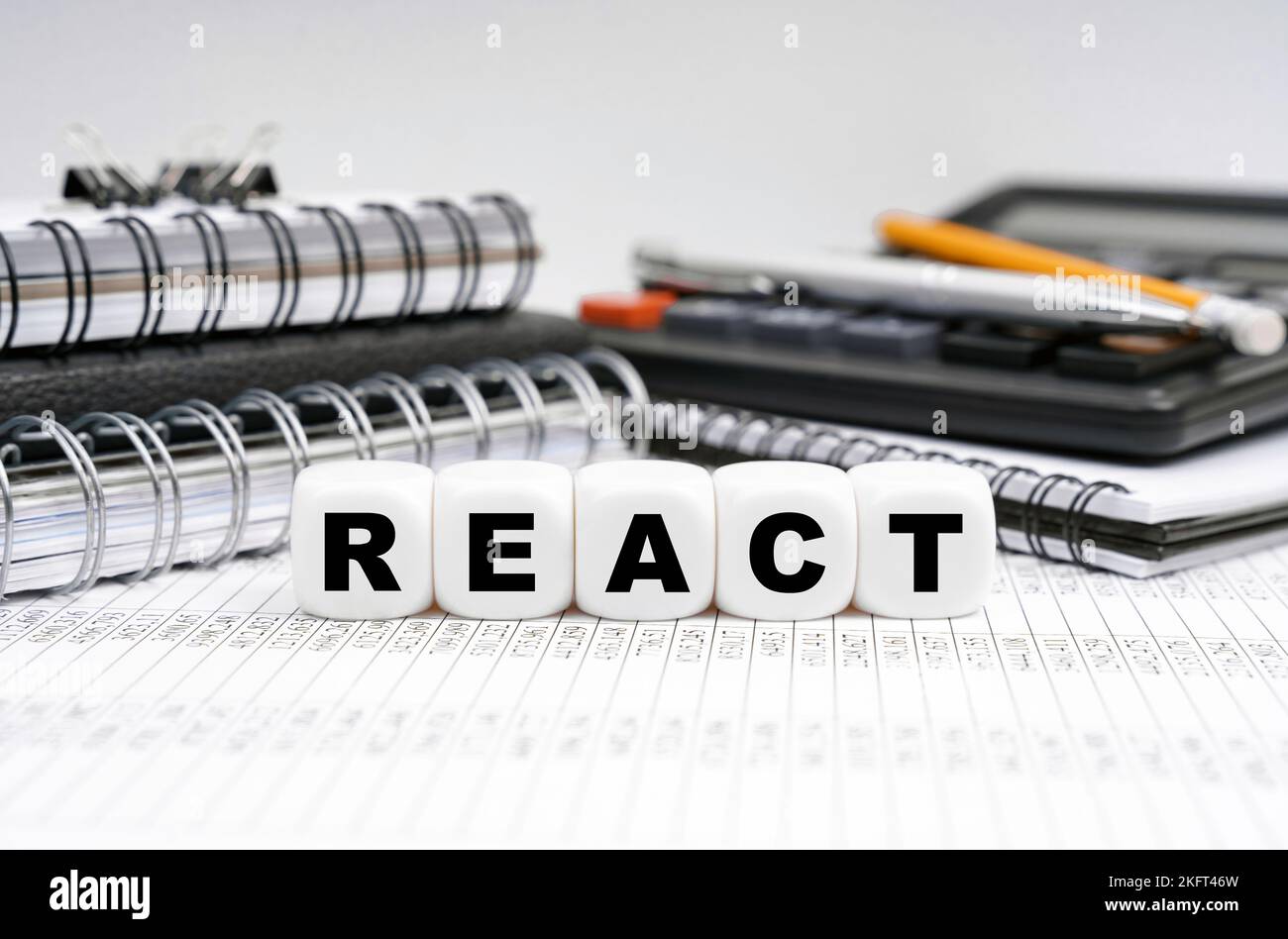 Business and finance concept. On the table, among office objects, cubes ...