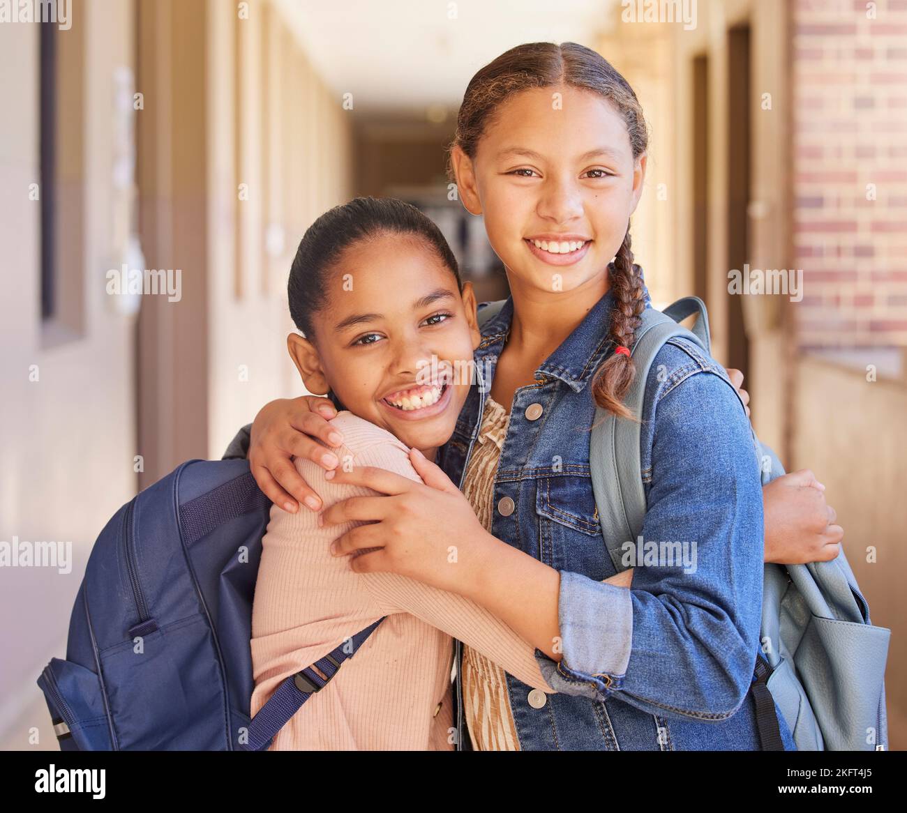 School, friends and portrait of children hugging in hallway excited for class, learning and ...