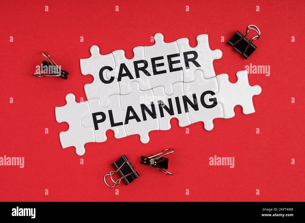 Business and Economics. On a red background, there are puzzles with the ...