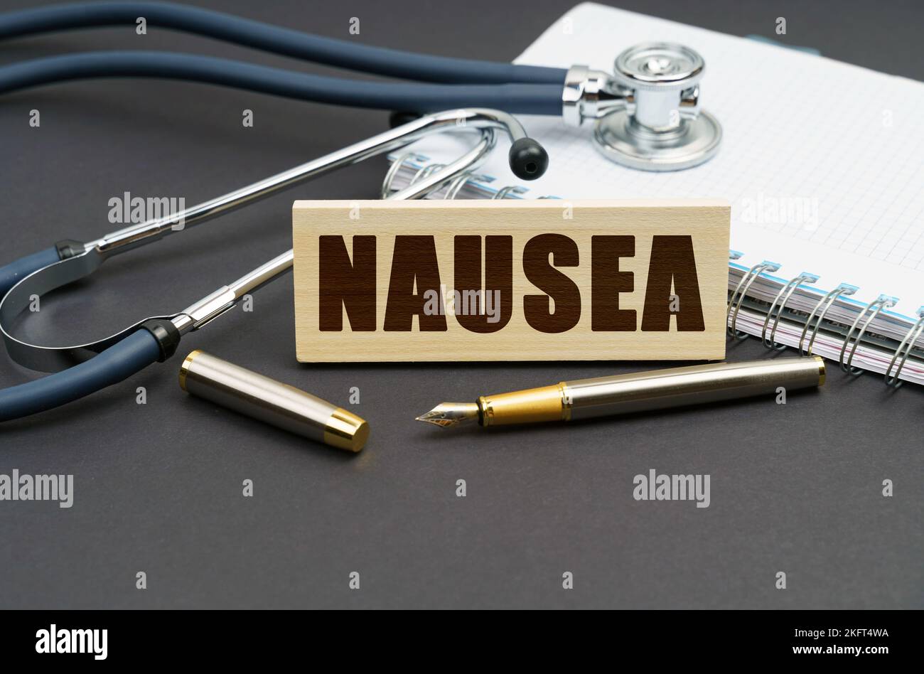 Medicine concept. On the table is a notebook, a stethoscope and a sign ...