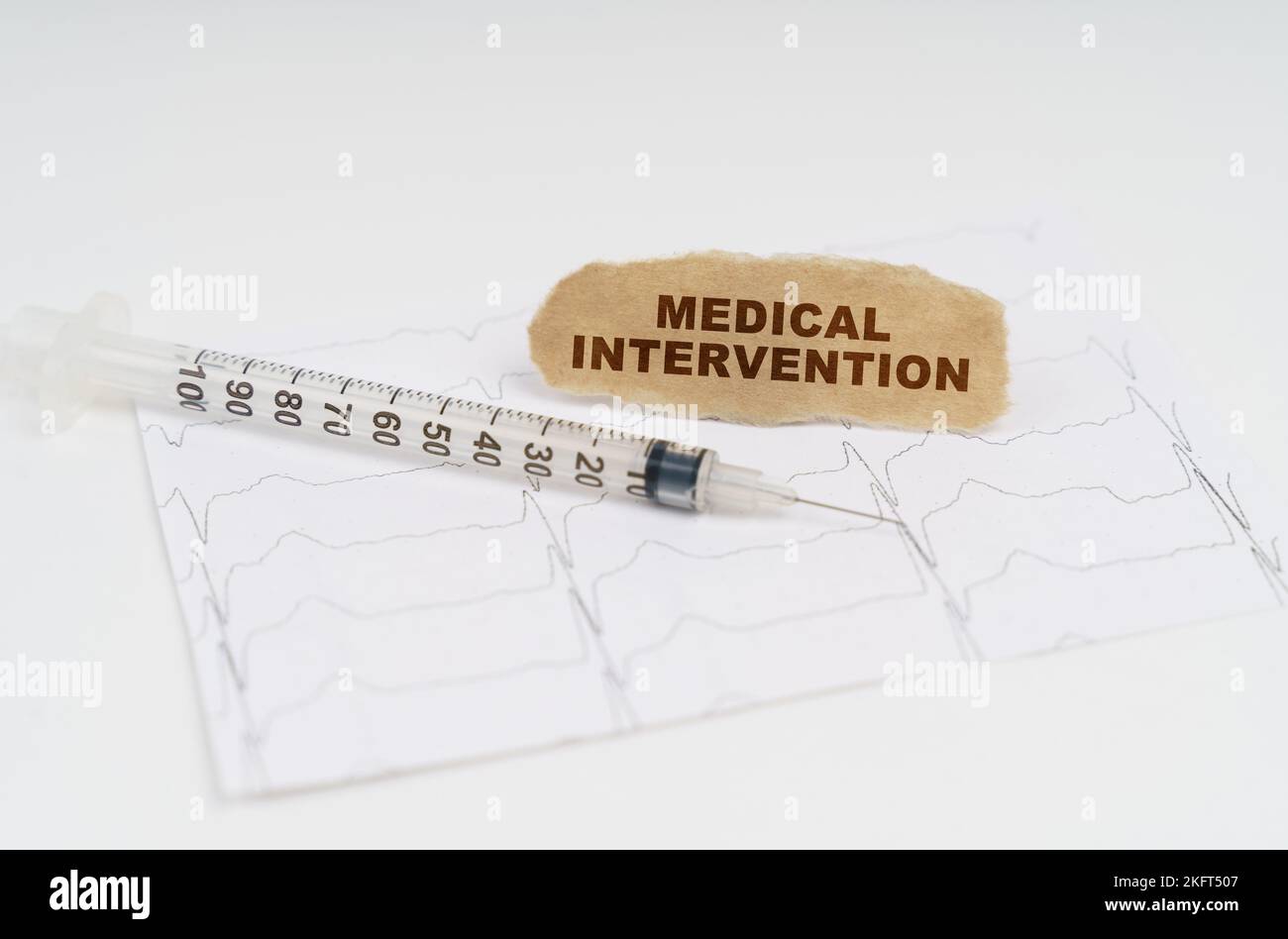 Medicine and health concept. On the table is a cardiogram, a syringe ...