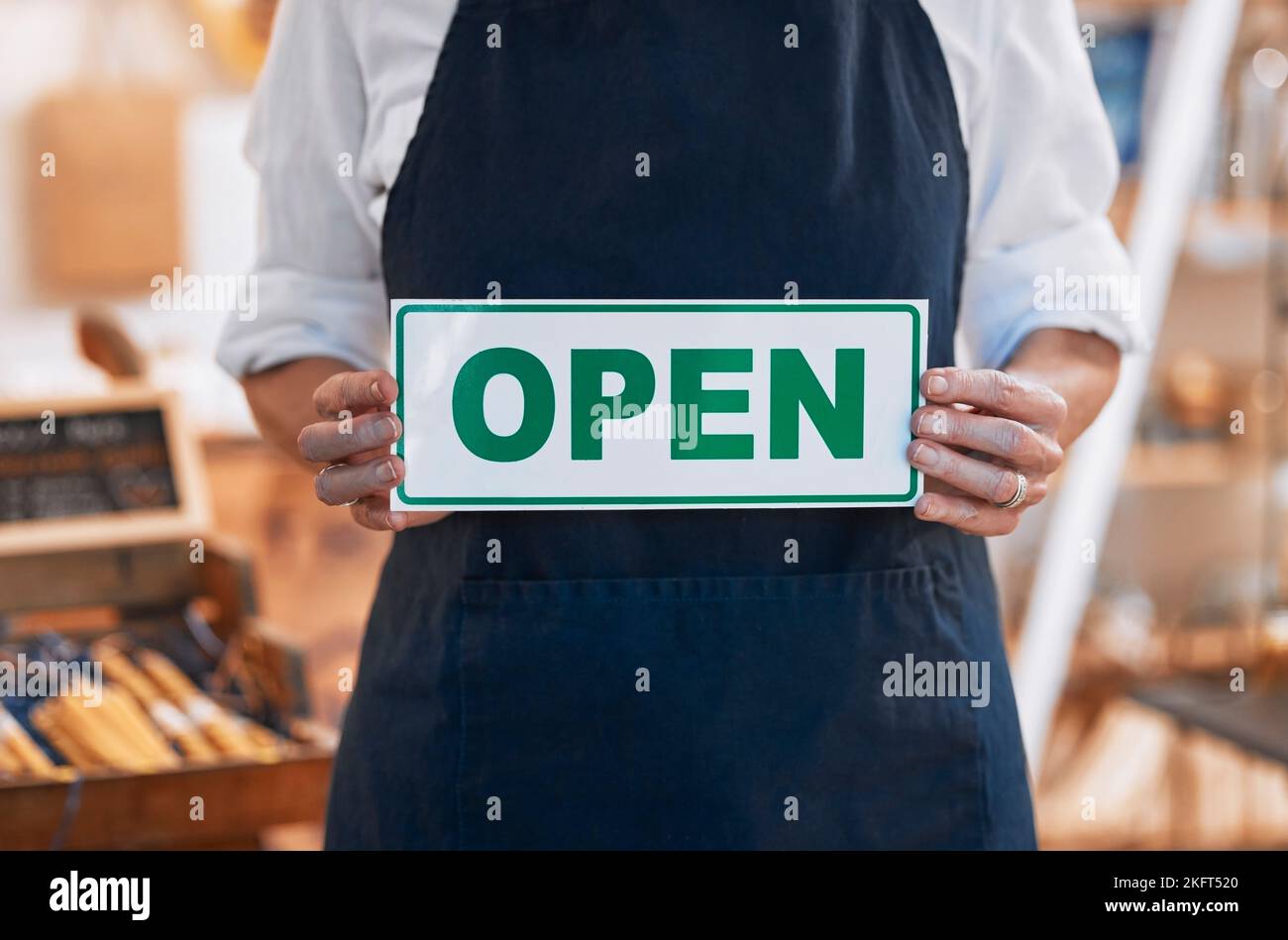 Closeup, open sign or small business woman, hands or retail store for ...