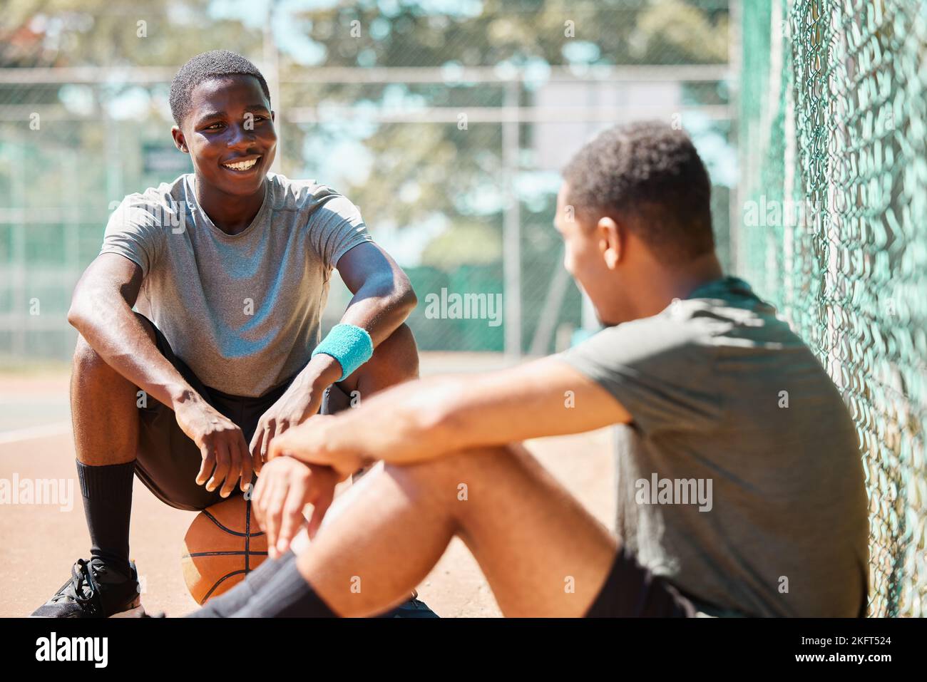 Basketball, sport and athlete friends talk after training, exercise and ...