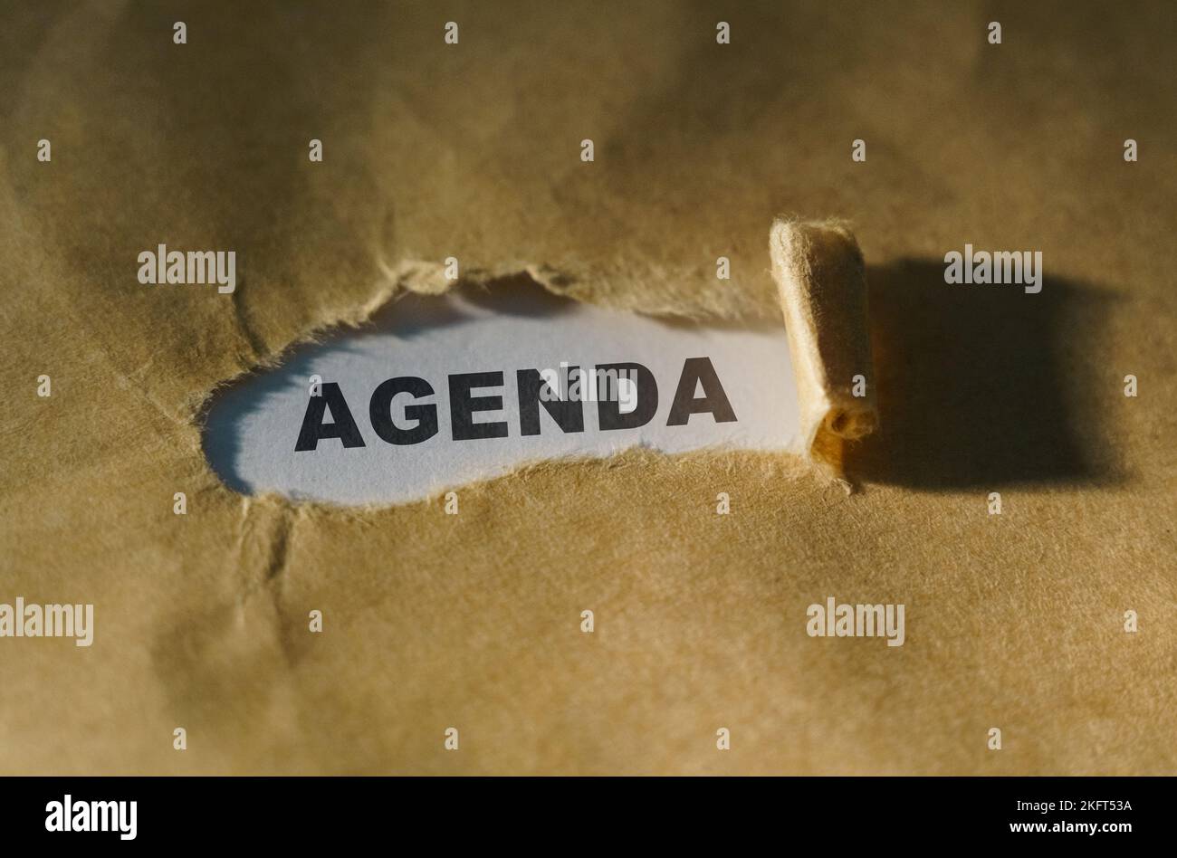 Economy and business concept. Torn paper in the middle of the sheet ...