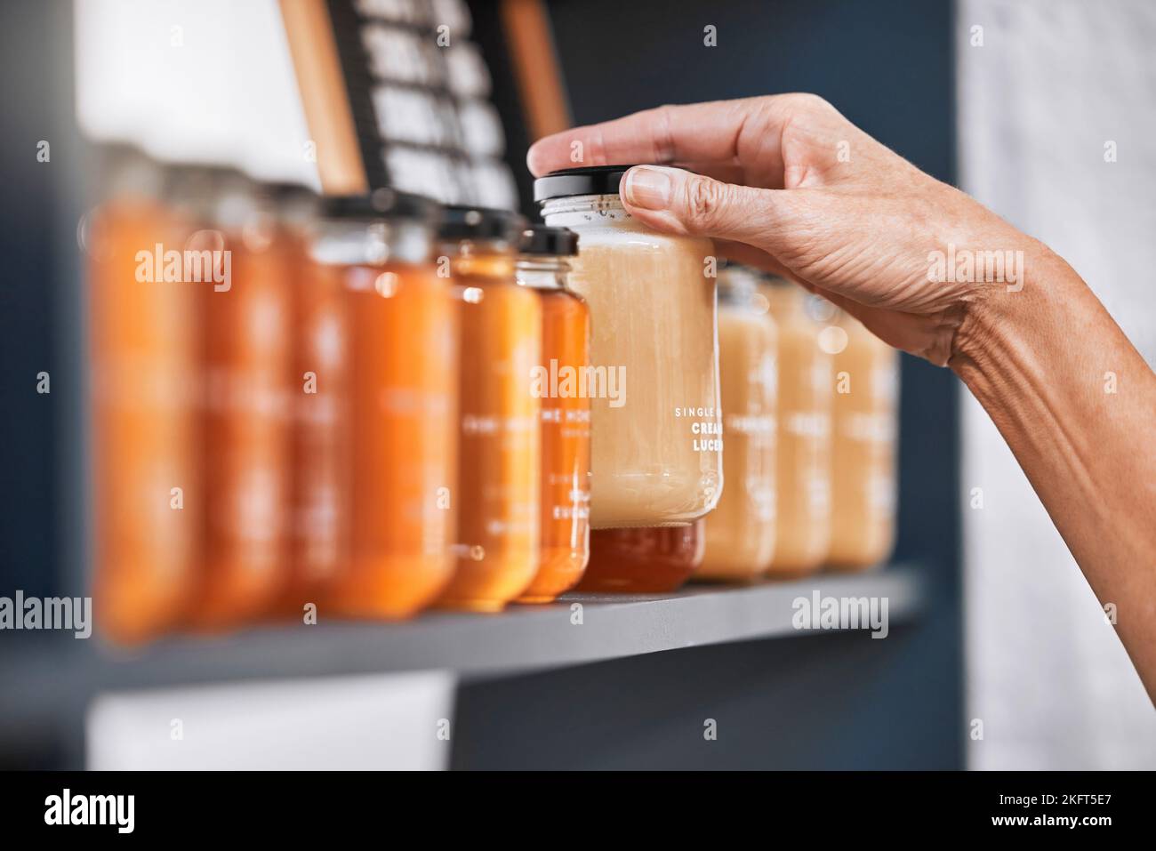 Hand picking glass jar shelf hi-res stock photography and images - Alamy