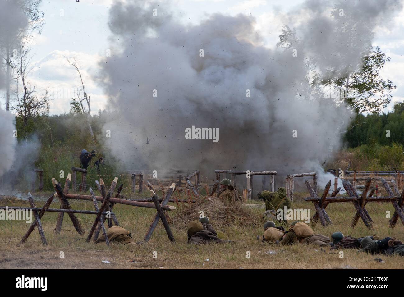 Battle of Soviet and German soldiers in wooden fortifications. Smoke ...