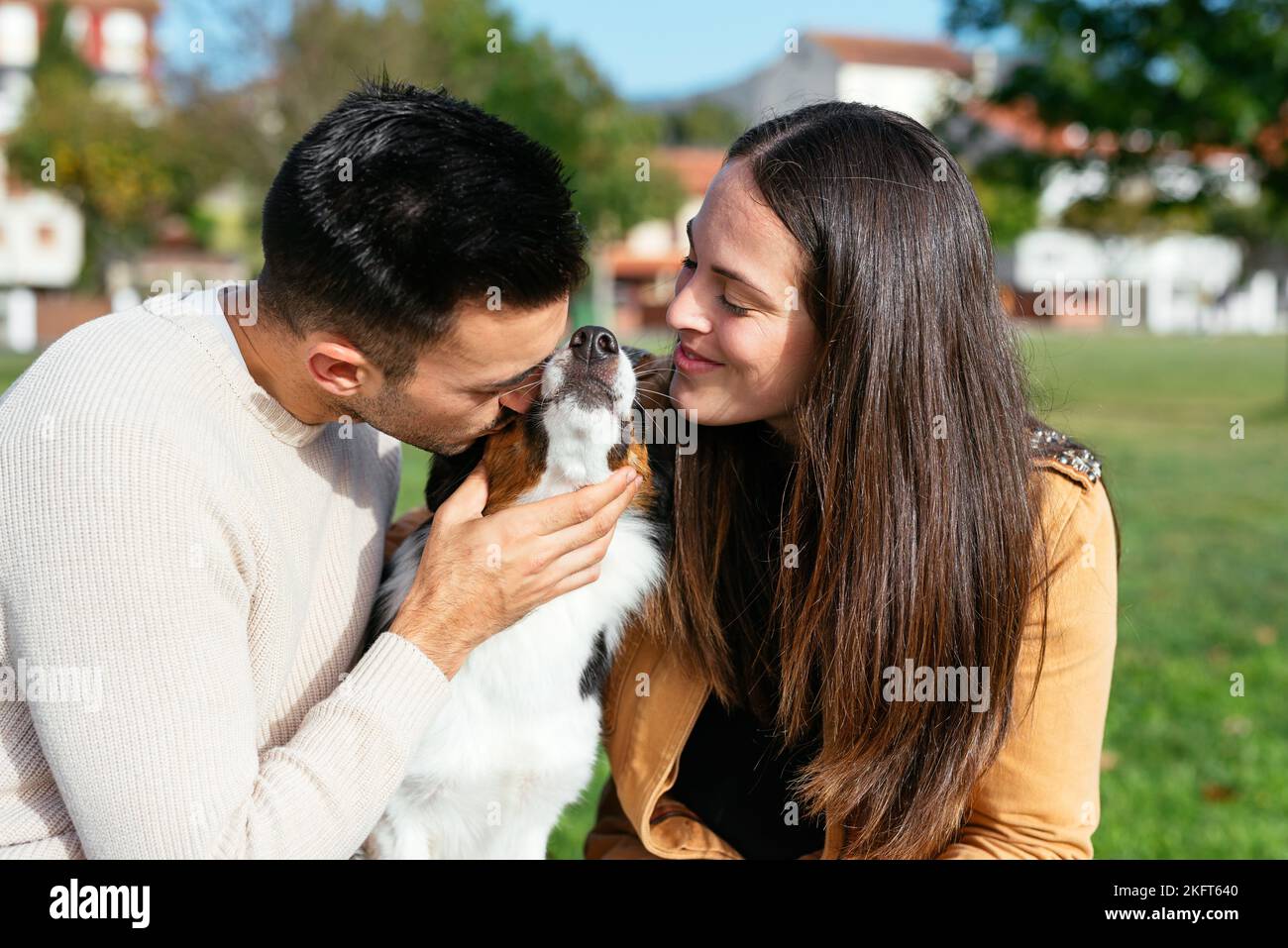 Happy man and woman in casual clothes embracing and kissing cute Border ...