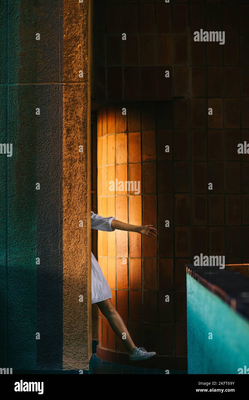 Man Hiding Behind Wall