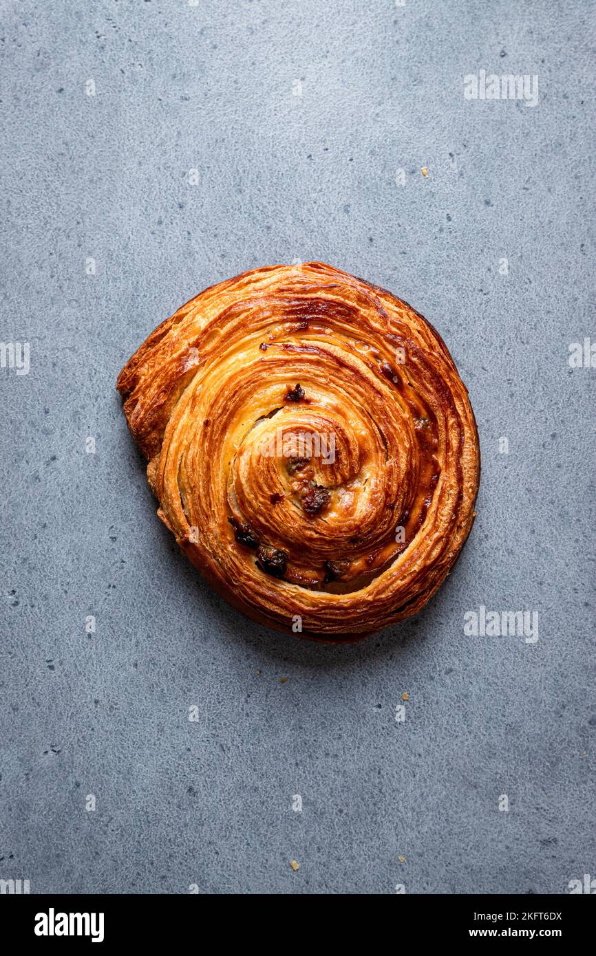 Top view of snail pastry placed on grey board Stock Photo - Alamy
