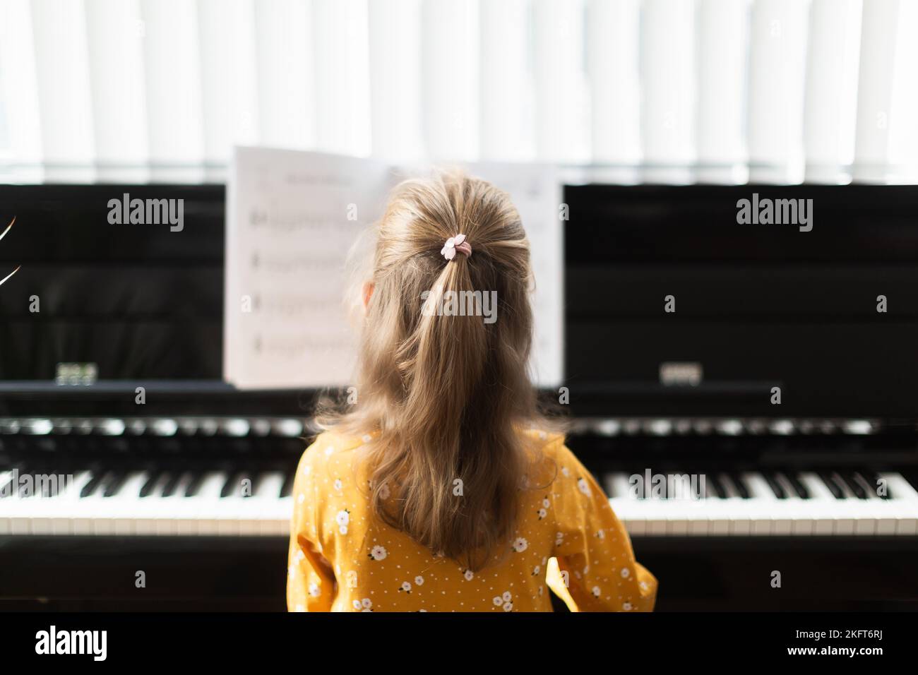 Kid piano back view hi-res stock photography and images - Alamy