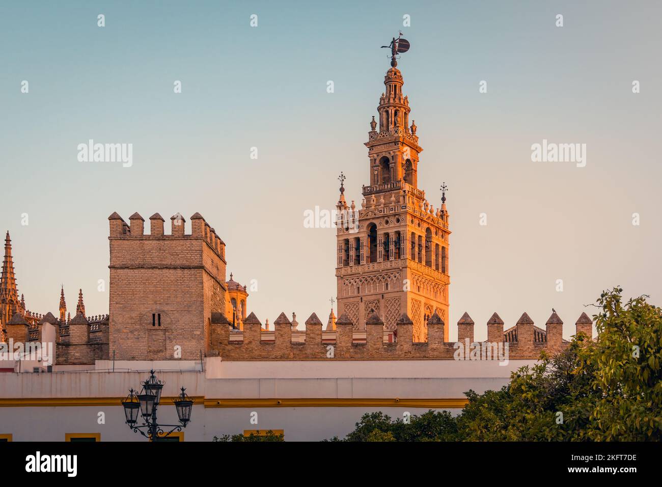 Ancient building of famous old Seville cathedral with tall tower and ...