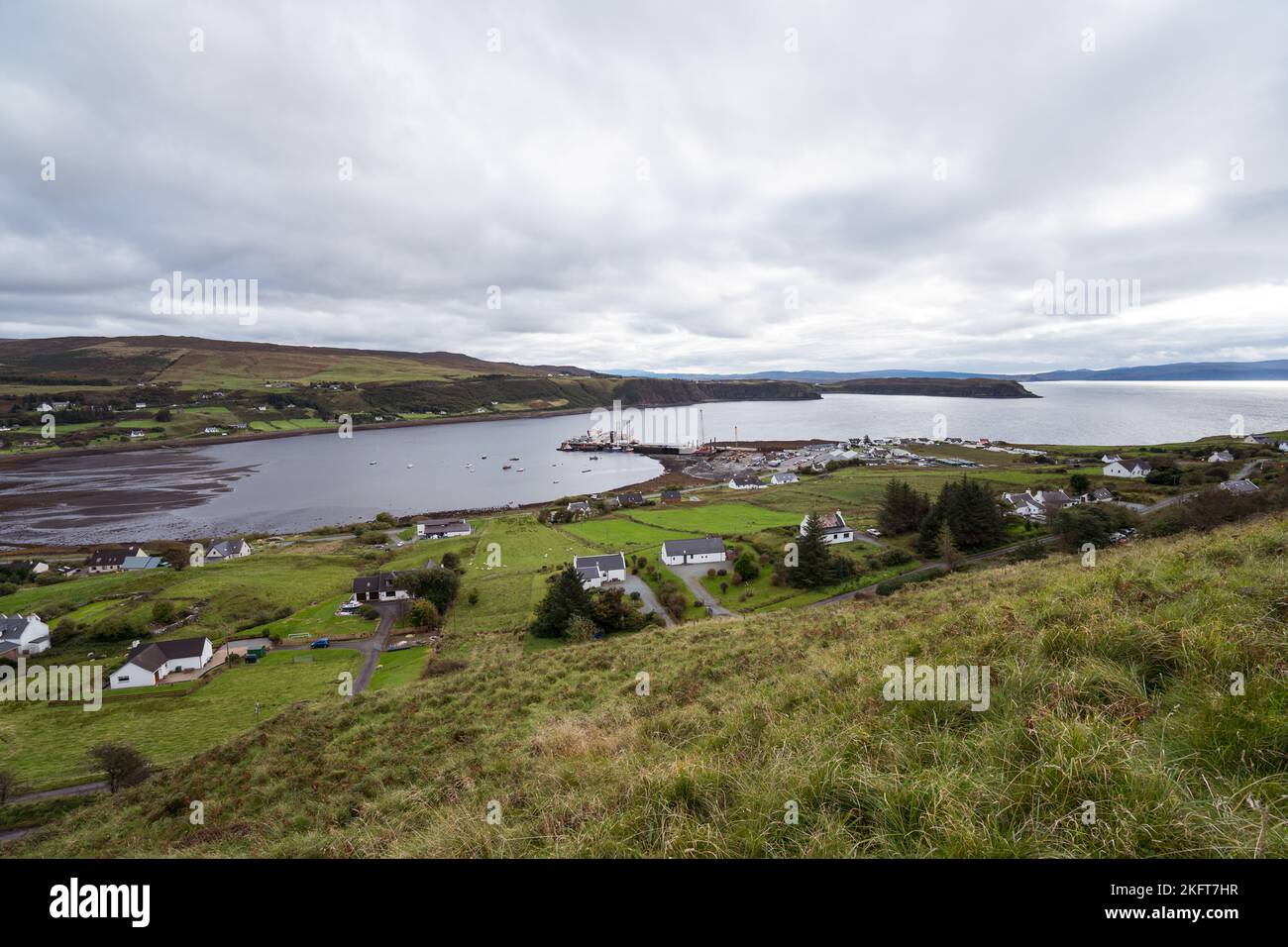 From above scenic view on small settlement located among green grassy ...