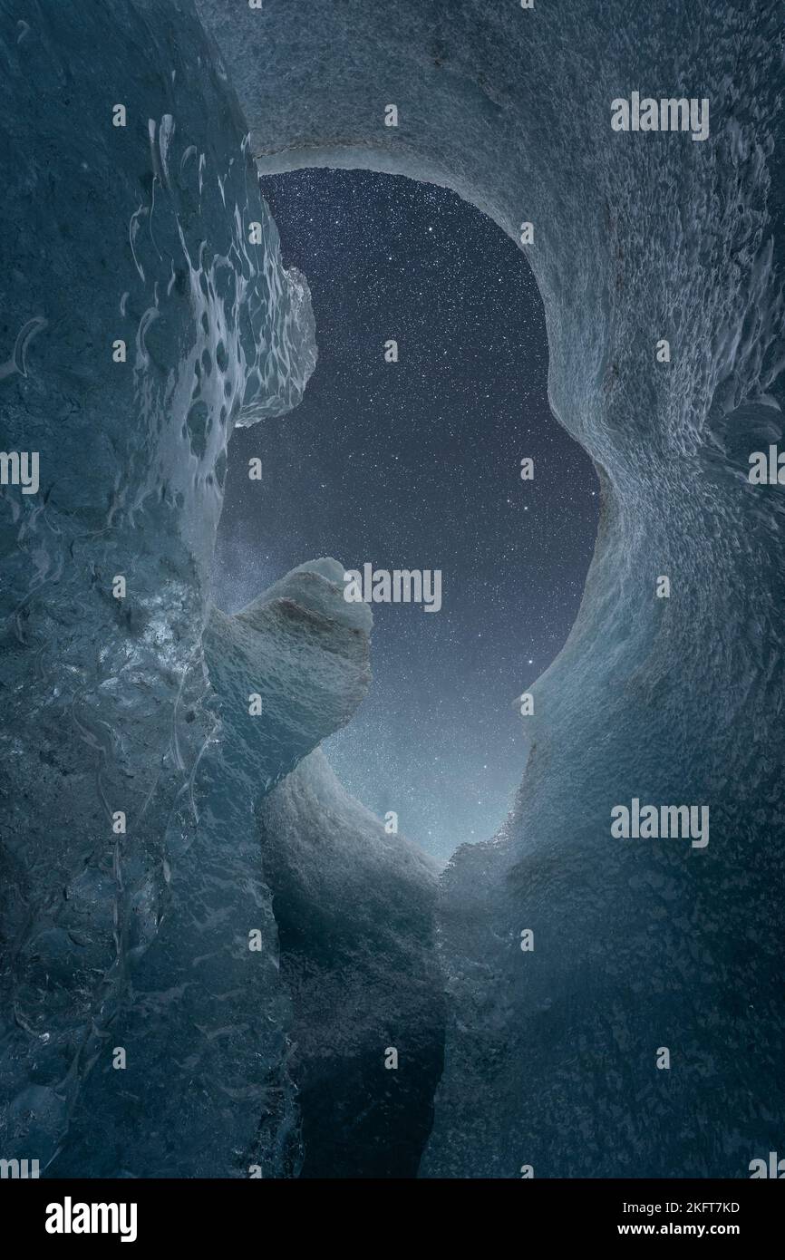 From below of night blue sky illuminating with many bright stars at ...