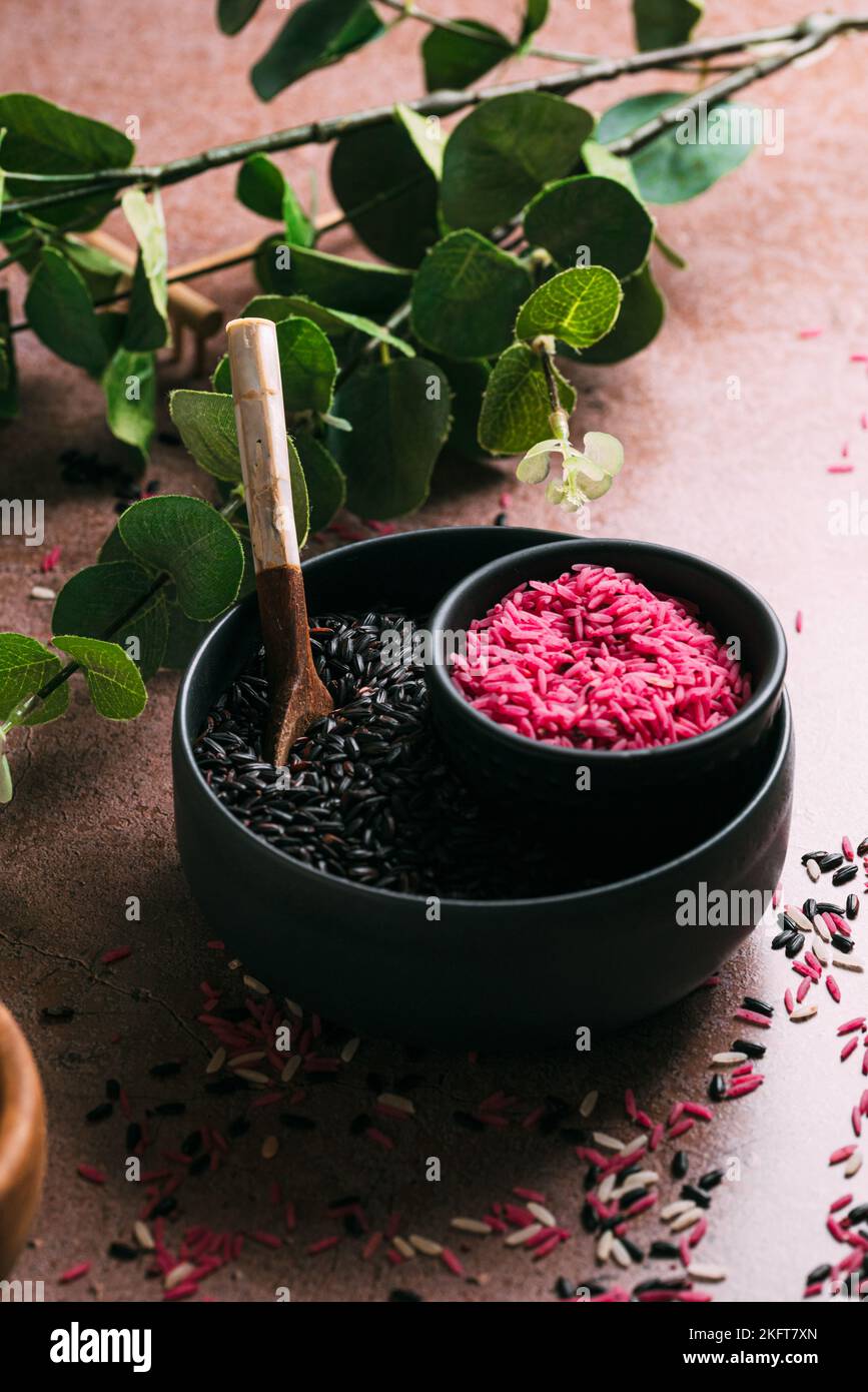 From above bowls with different types of rice placed on table near ...