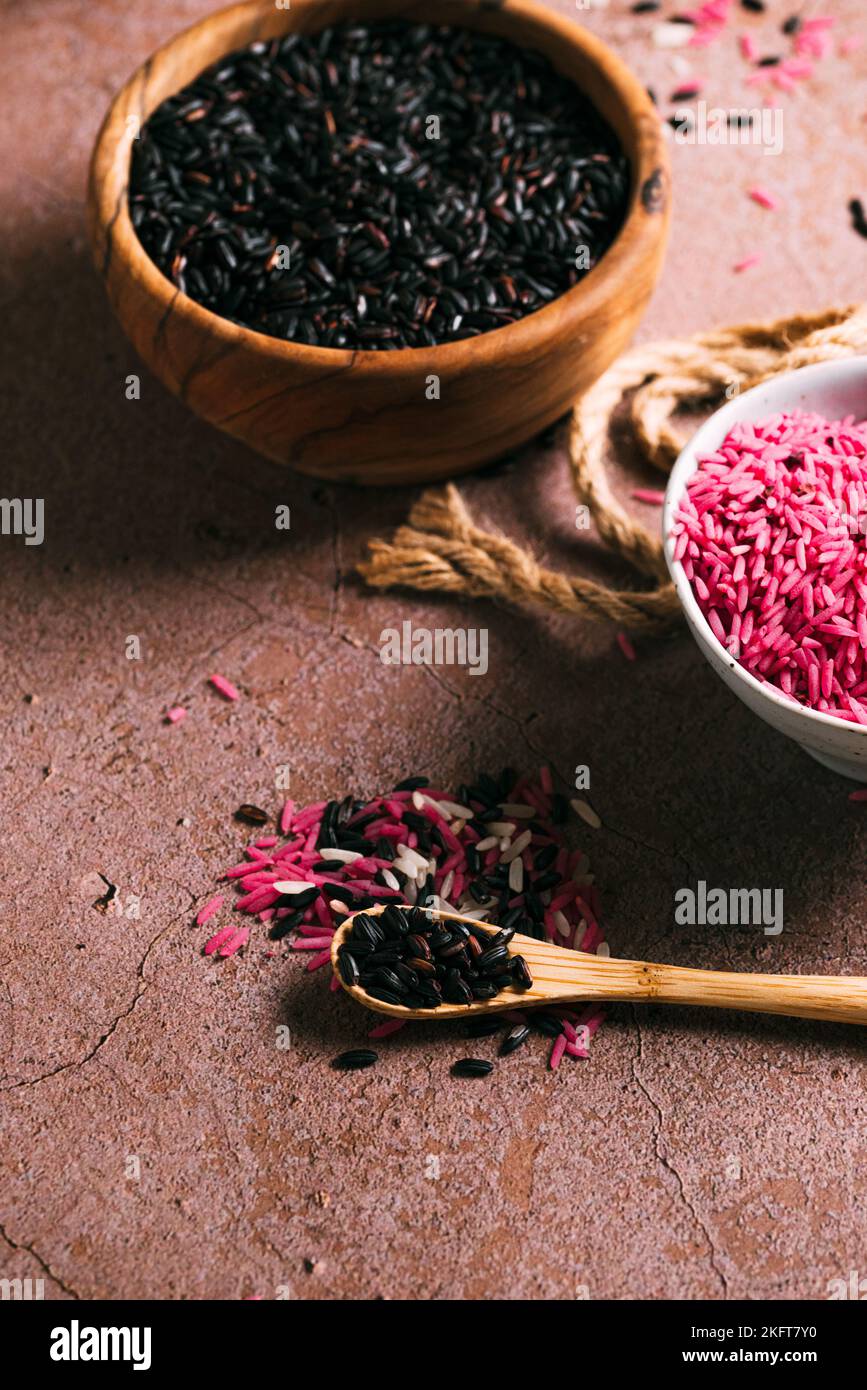 From above bowls with different types of rice placed on table near ...