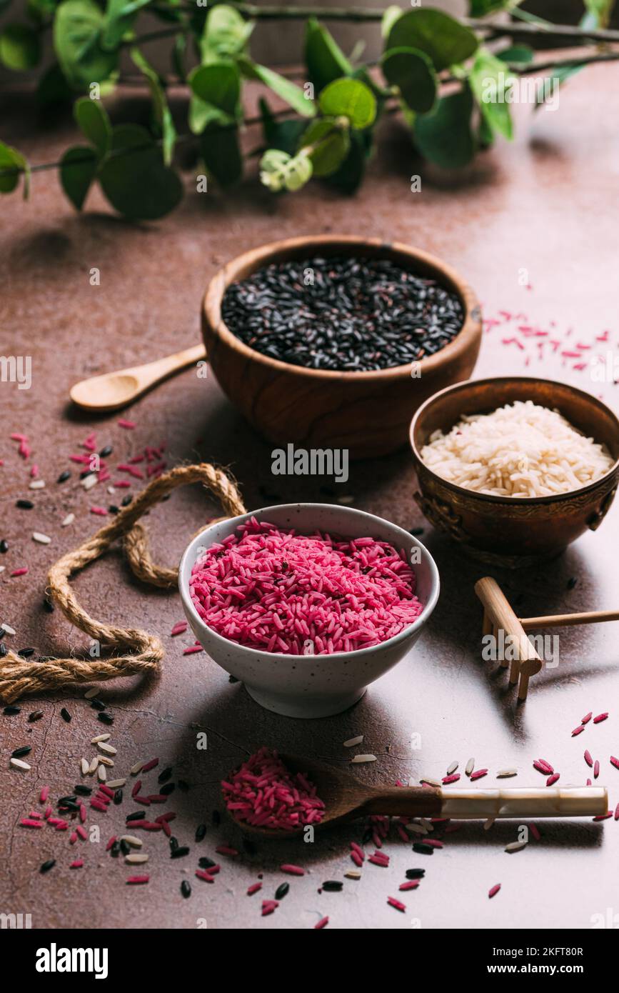 From above bowls with different types of rice placed on table near ...