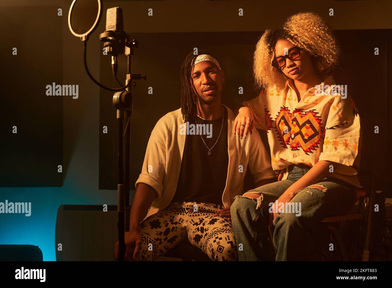 Female singer leaning microphone during hi-res stock photography and ...