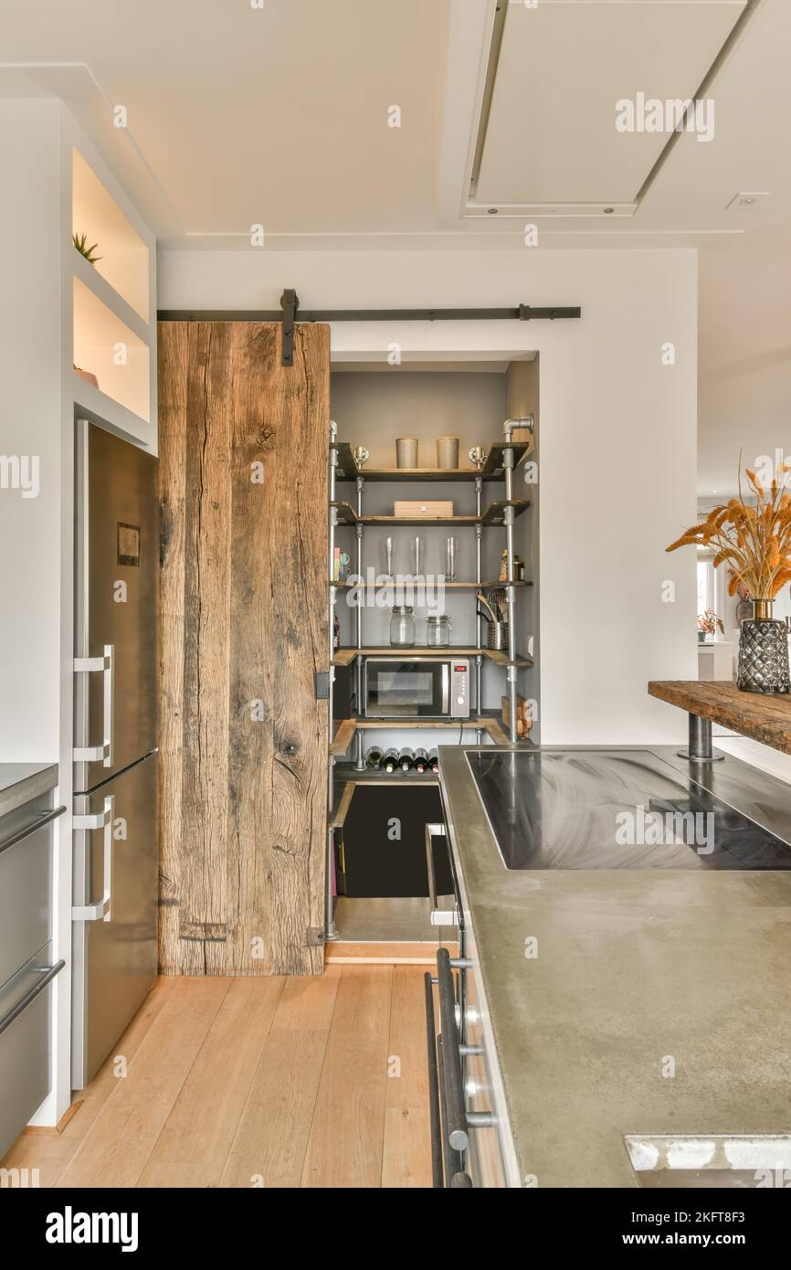 Spacious kitchen with minimalist style furniture and modern built in ...