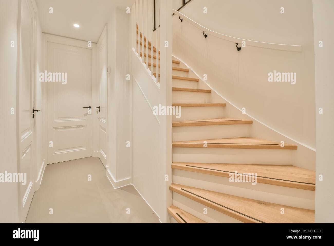 Interior of a house with stairs to an upper floor in a bright ...